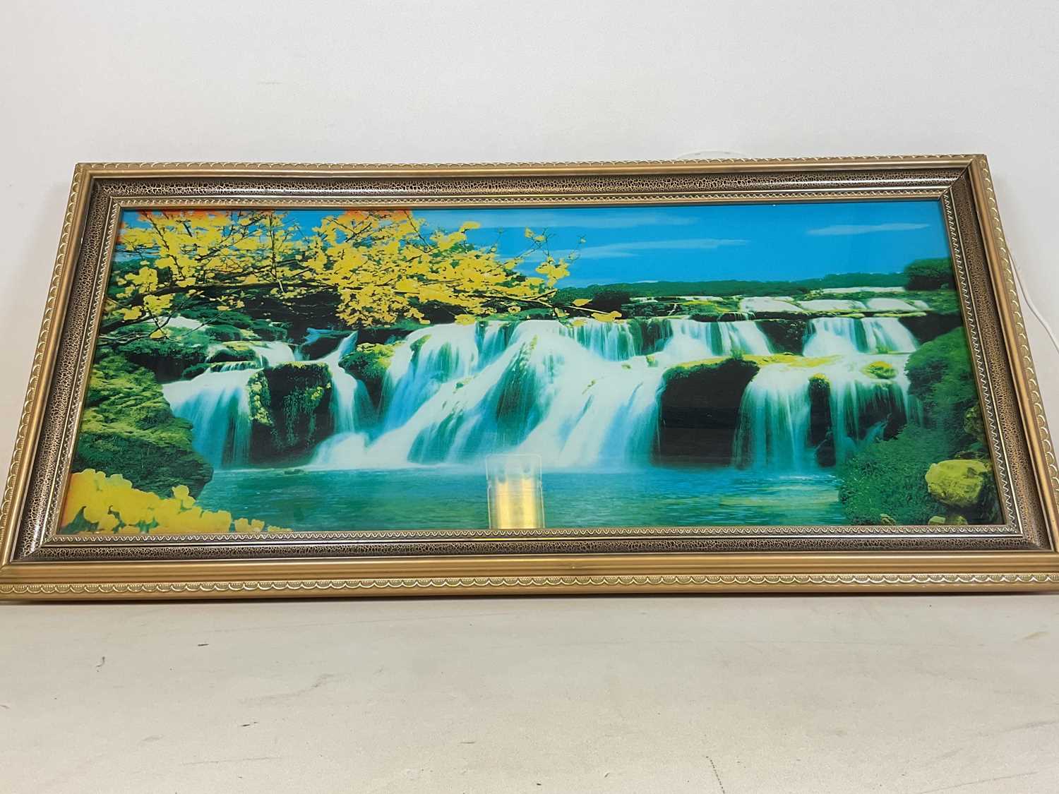 Lot 645 - A panoramic waterfall light in a frame.