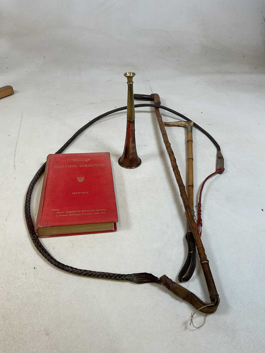 Lot 100 - Two vintage riding crops, a copper and brass