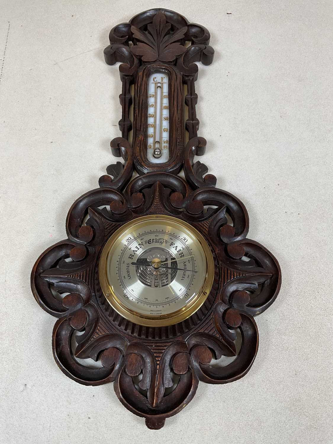 Lot 636 - A carved wood barometer, made in Germany,