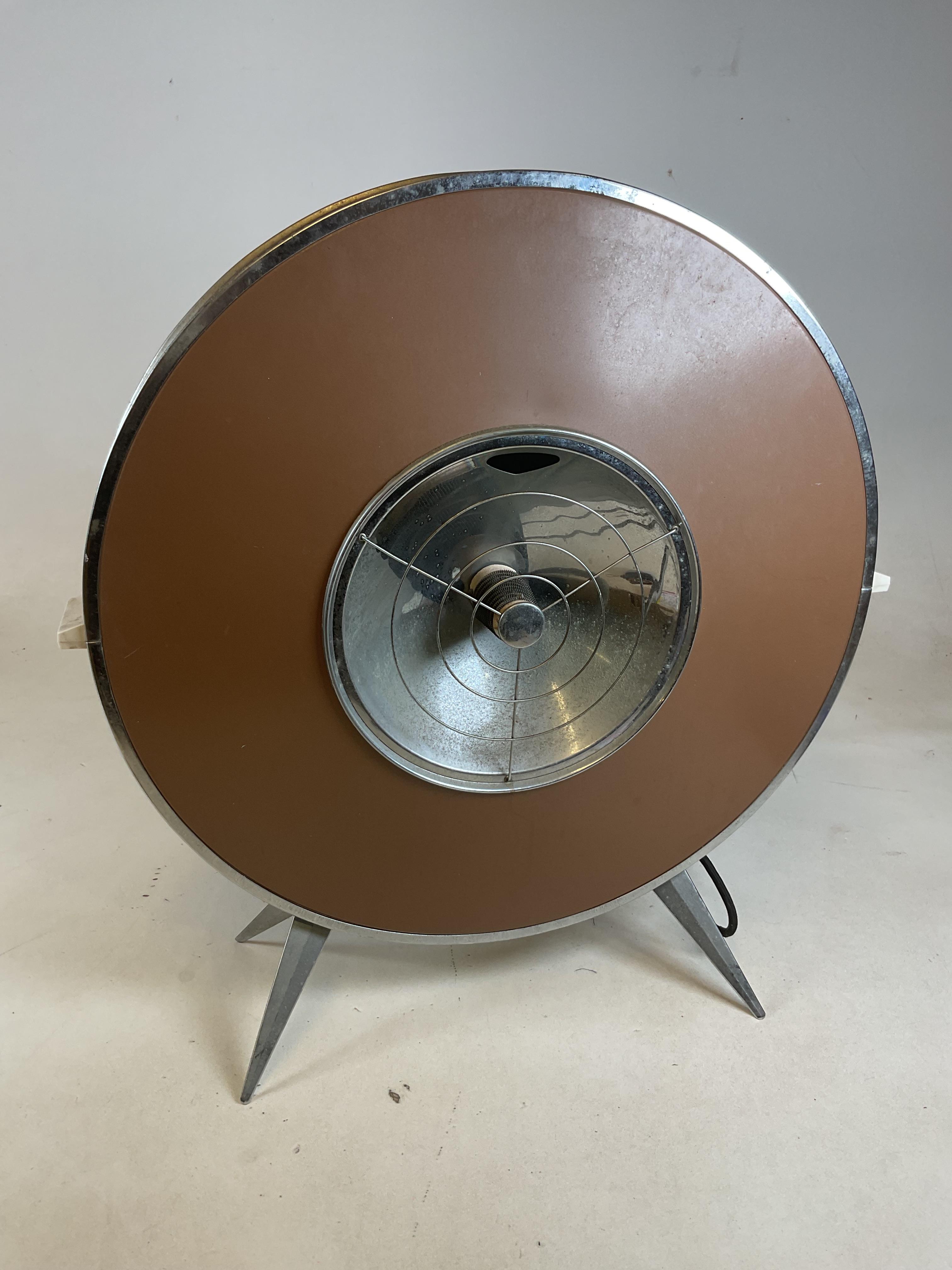 Lot 21 - A mid century circular Atomic space heater,