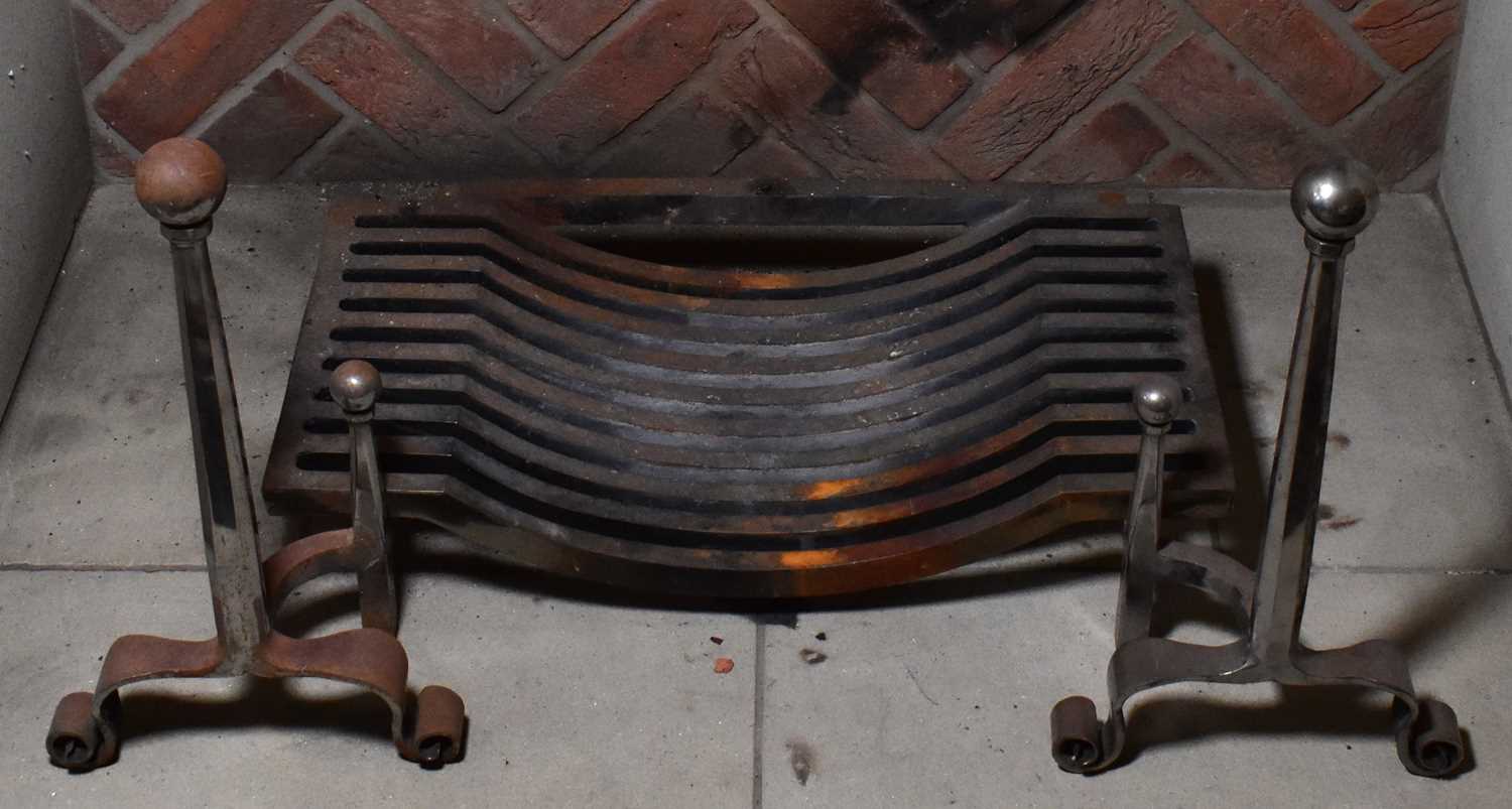 Lot 2628 - A modern blacksmith-made fire grate and