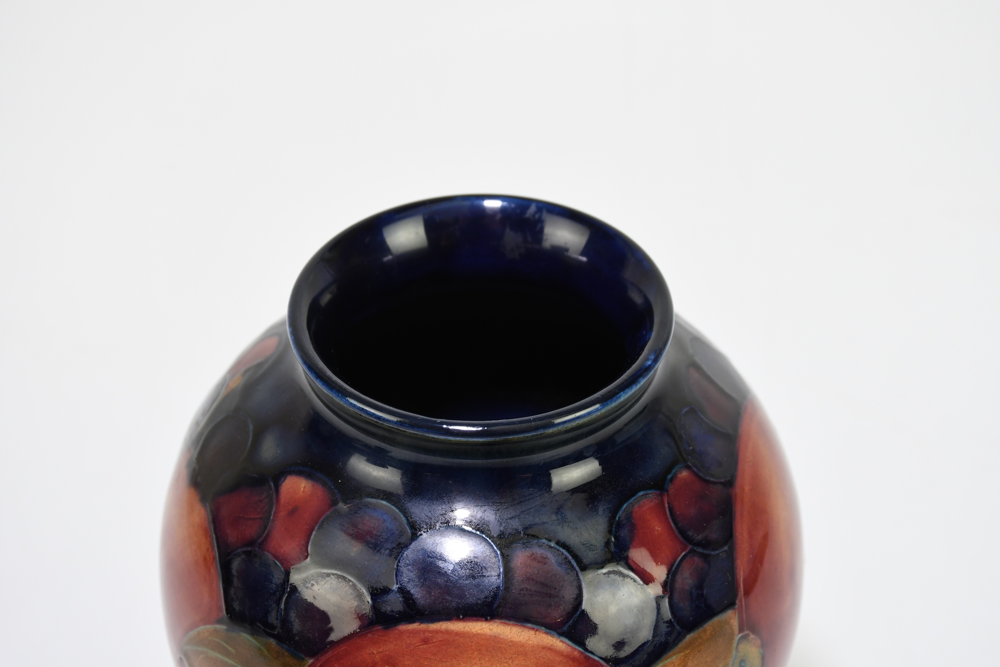 Lot 20 - MOORCROFT; a 'Pomegranate' pattern vase,