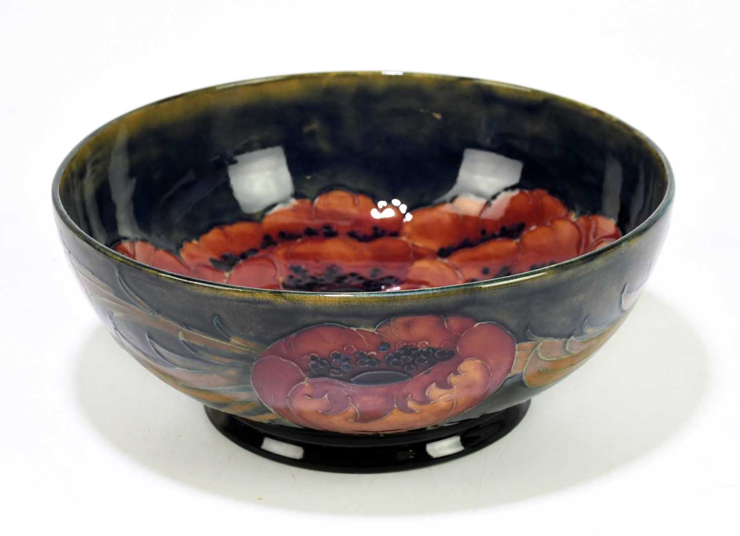Lot 22 - MOORCROFT; a 'Poppy' pattern bowl, the