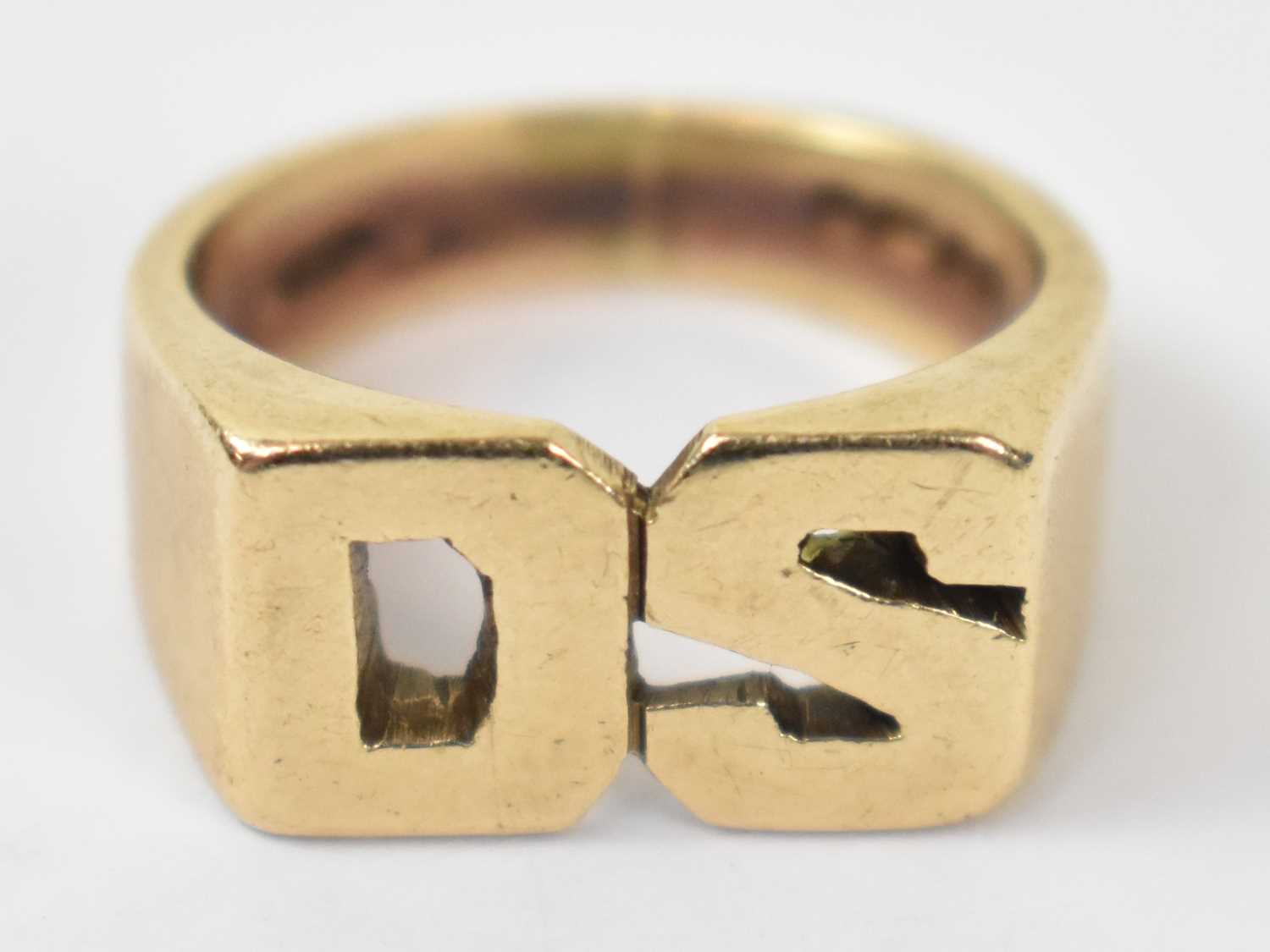 Lot 908 - A 9ct yellow gold ring with initials DS,