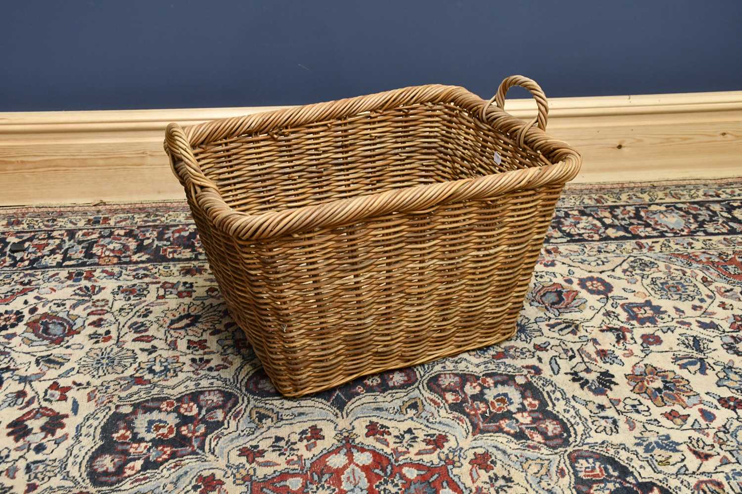 Lot 2409 - A large wicker log basket, length 61cm.