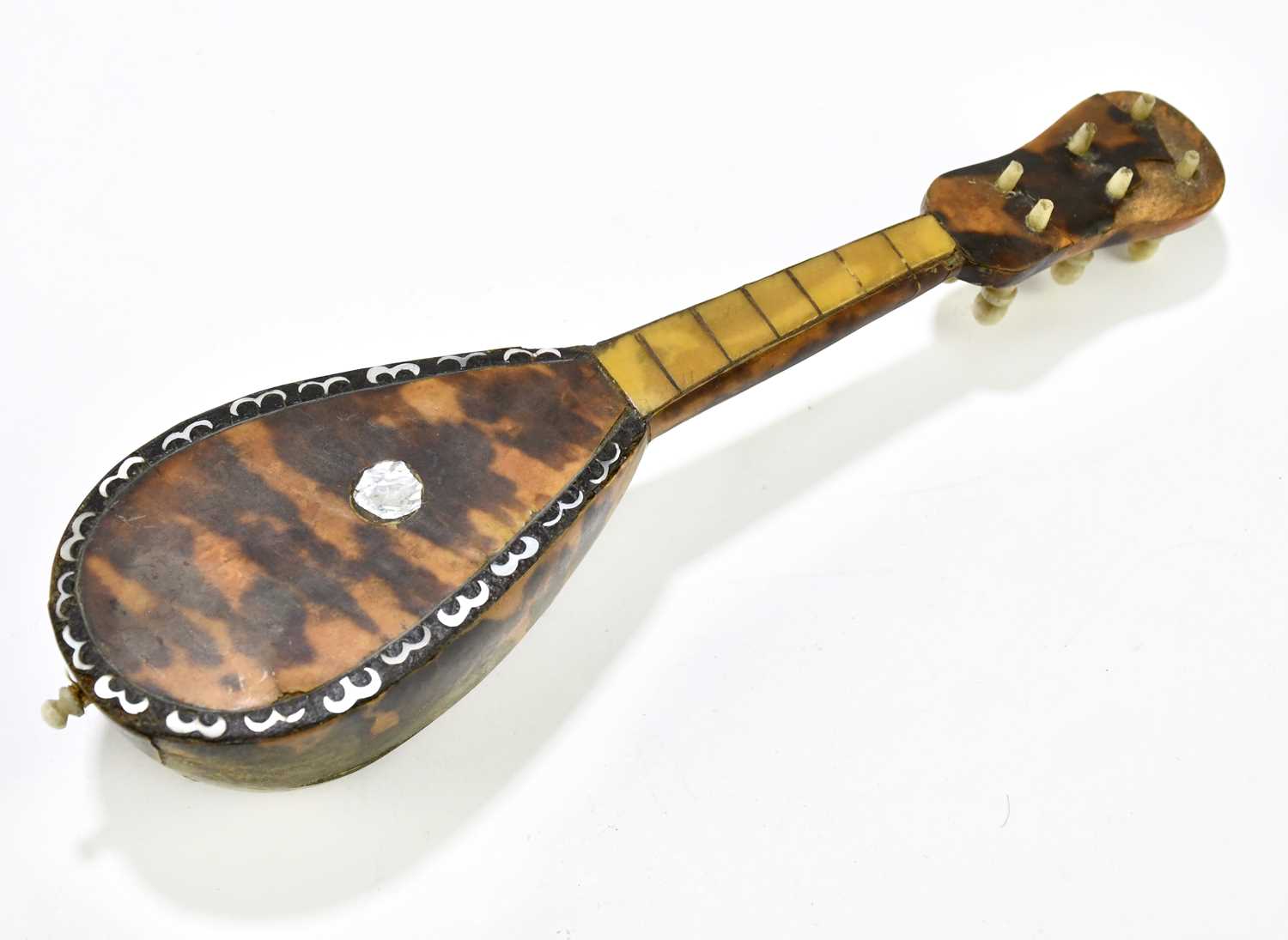 Lot 2473 - A miniature tortoiseshell mandolin, 20cm.