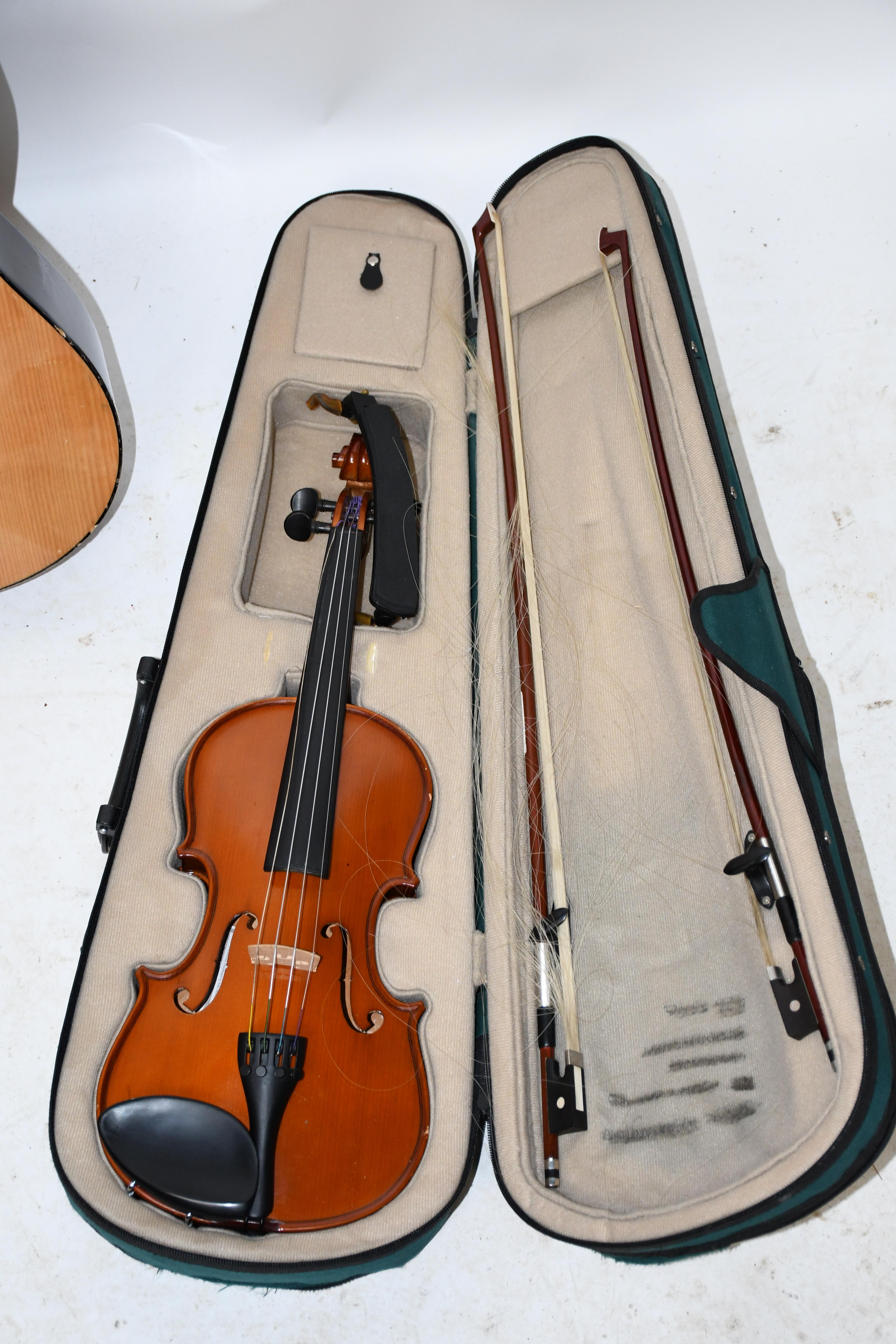 Lot 236 - Two modern cased violins and modern acoustic
