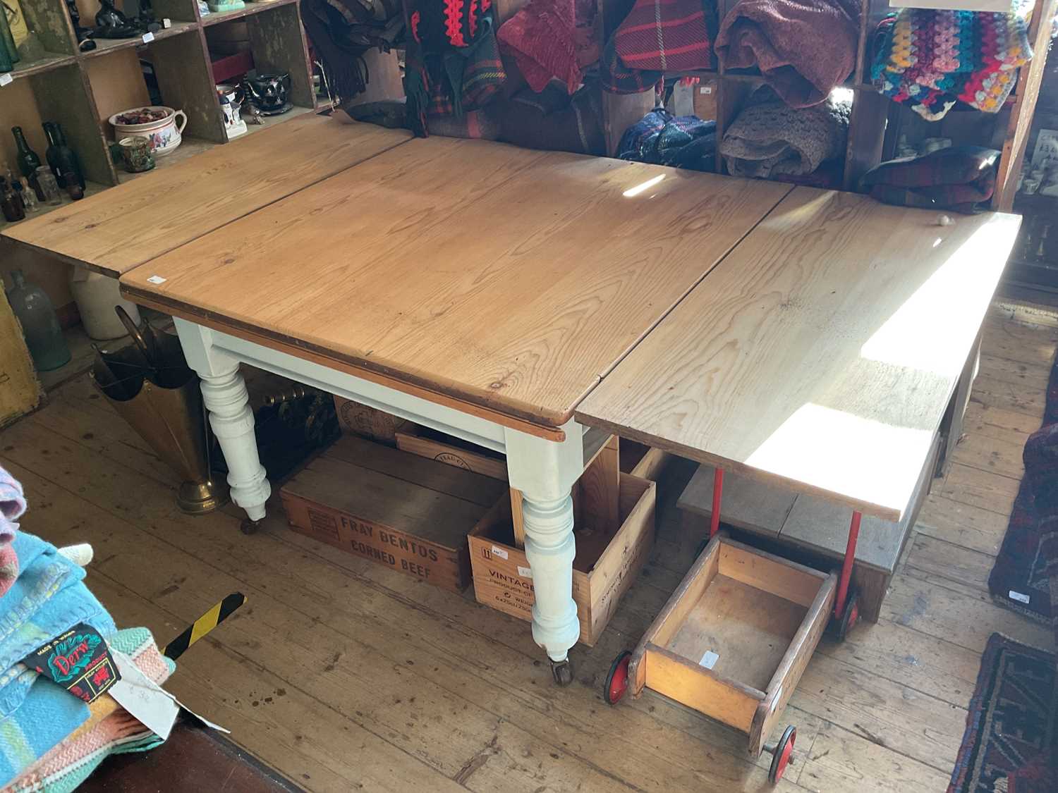 Lot 446 - An old pine draw-leaf extending dining table