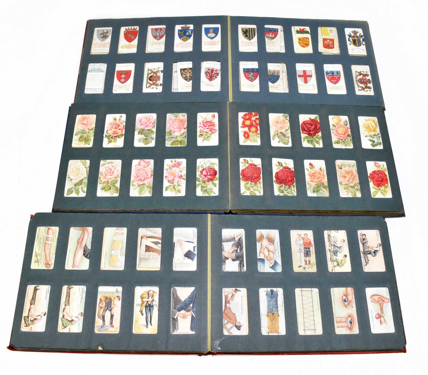 Lot 697 - Three cigarette card albums containing a