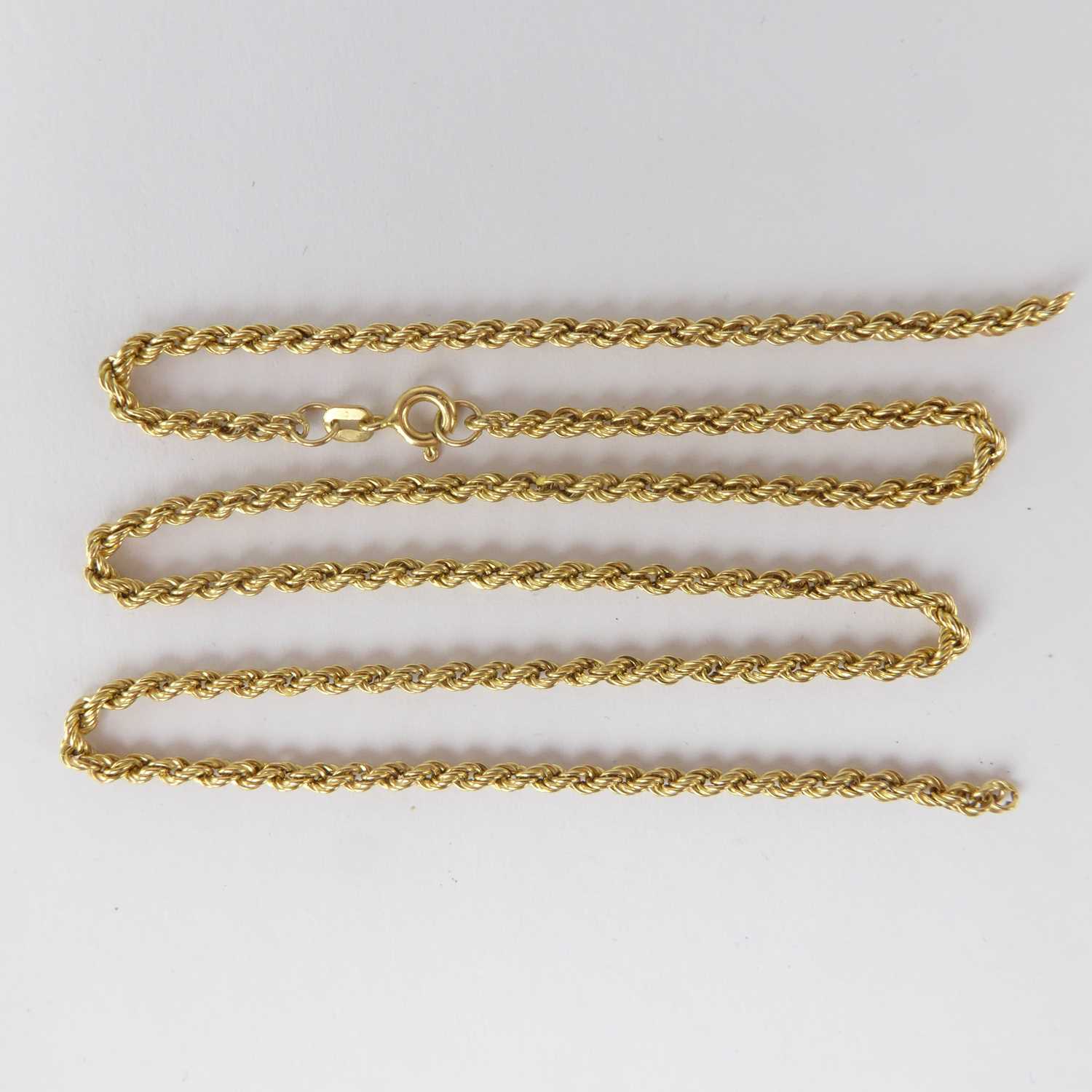 Lot 1251 - A 9ct gold rope twist necklace, length 46cm,