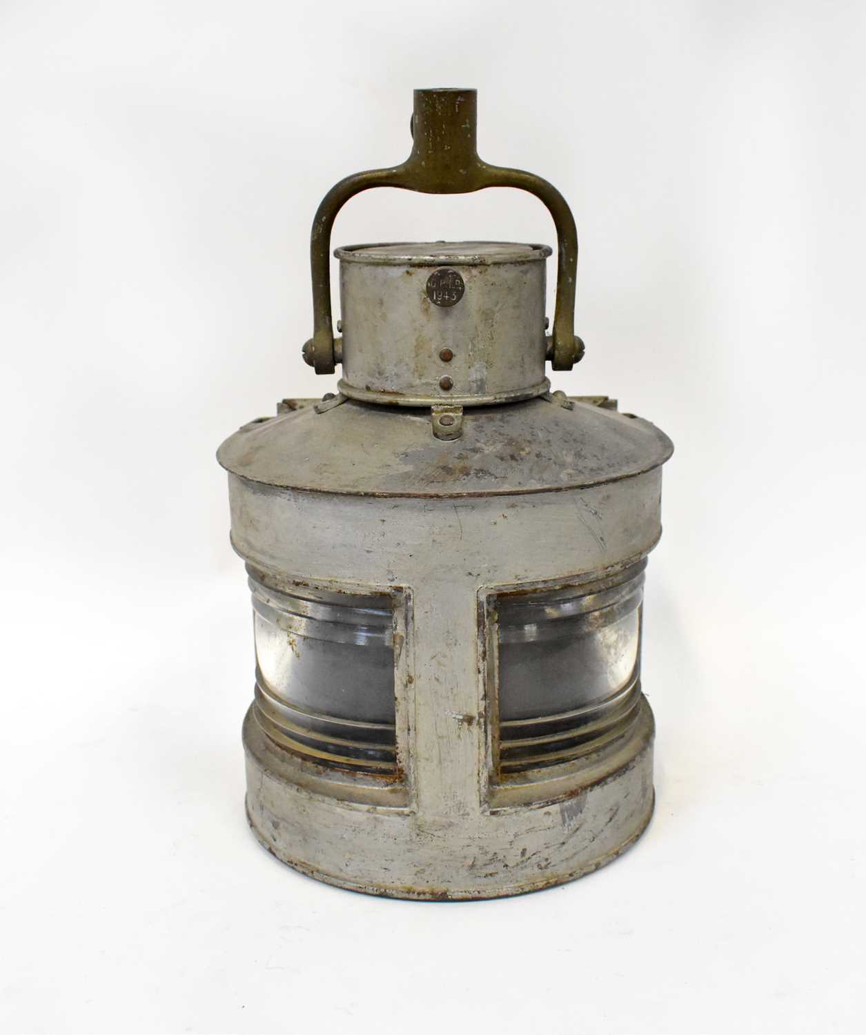 Lot 130 - An aluminium ship's lamp stamped GP Ld 1943,