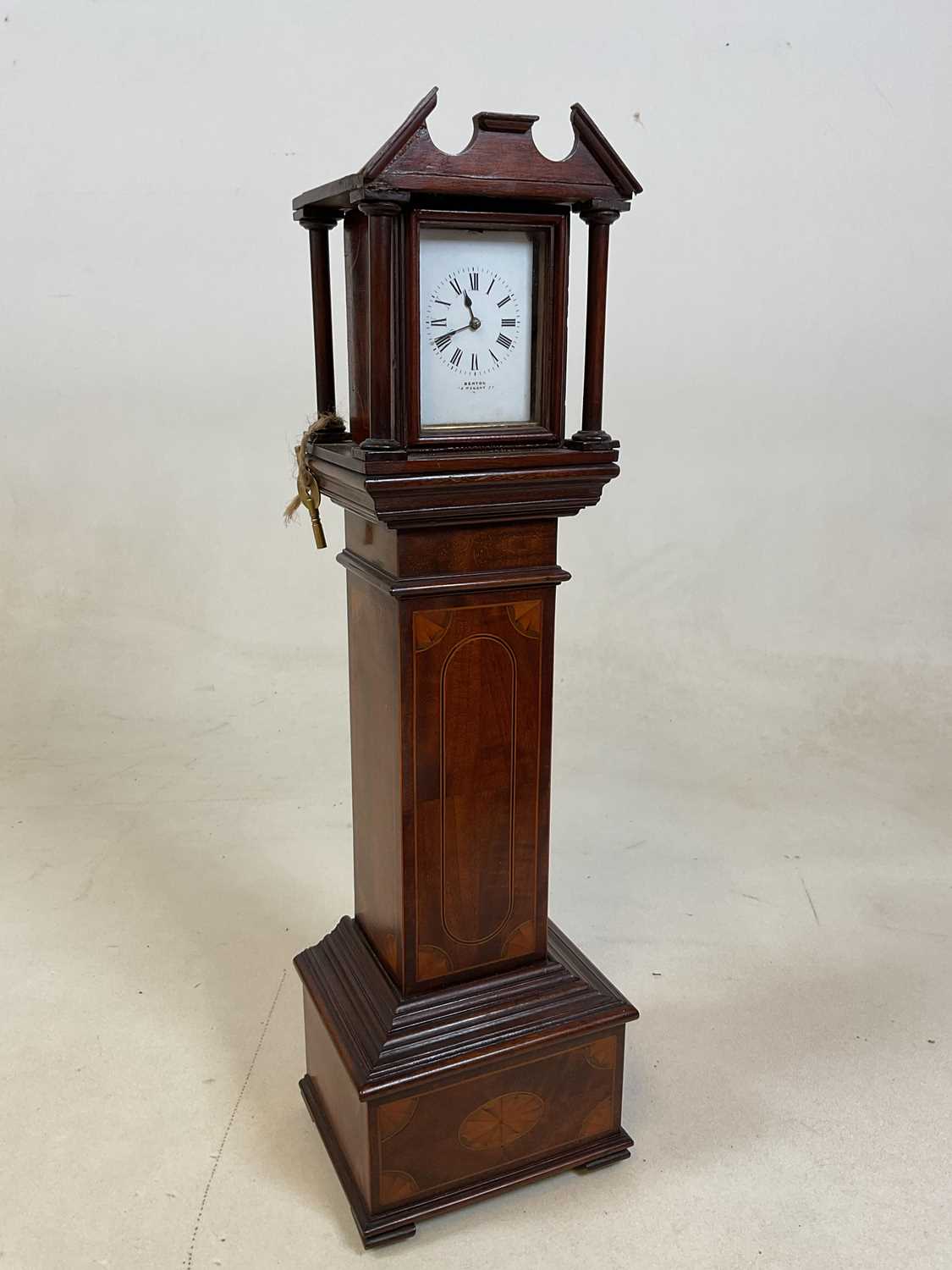 Lot 396 - A miniature longcase clock in an inlaid