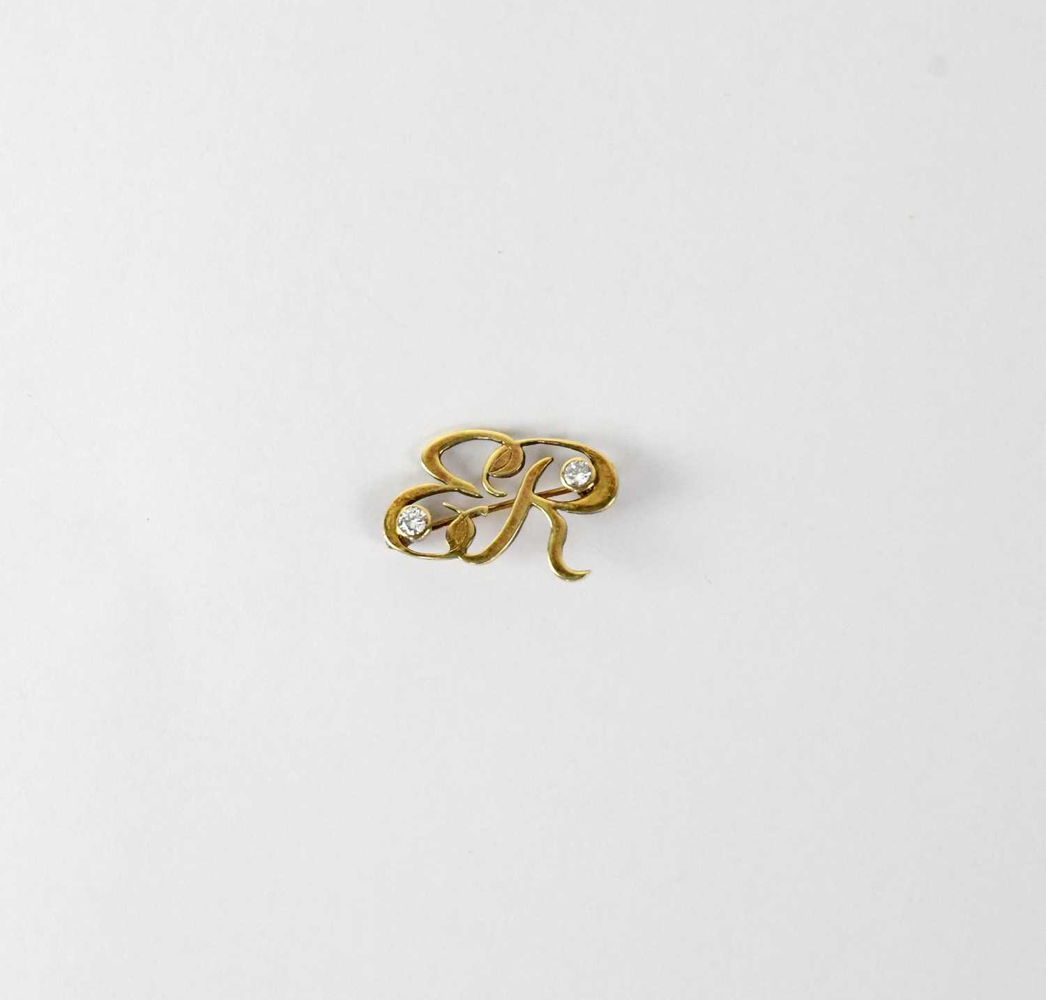 Lot 1196 - A 14ct yellow gold 'ER' initial brooch,