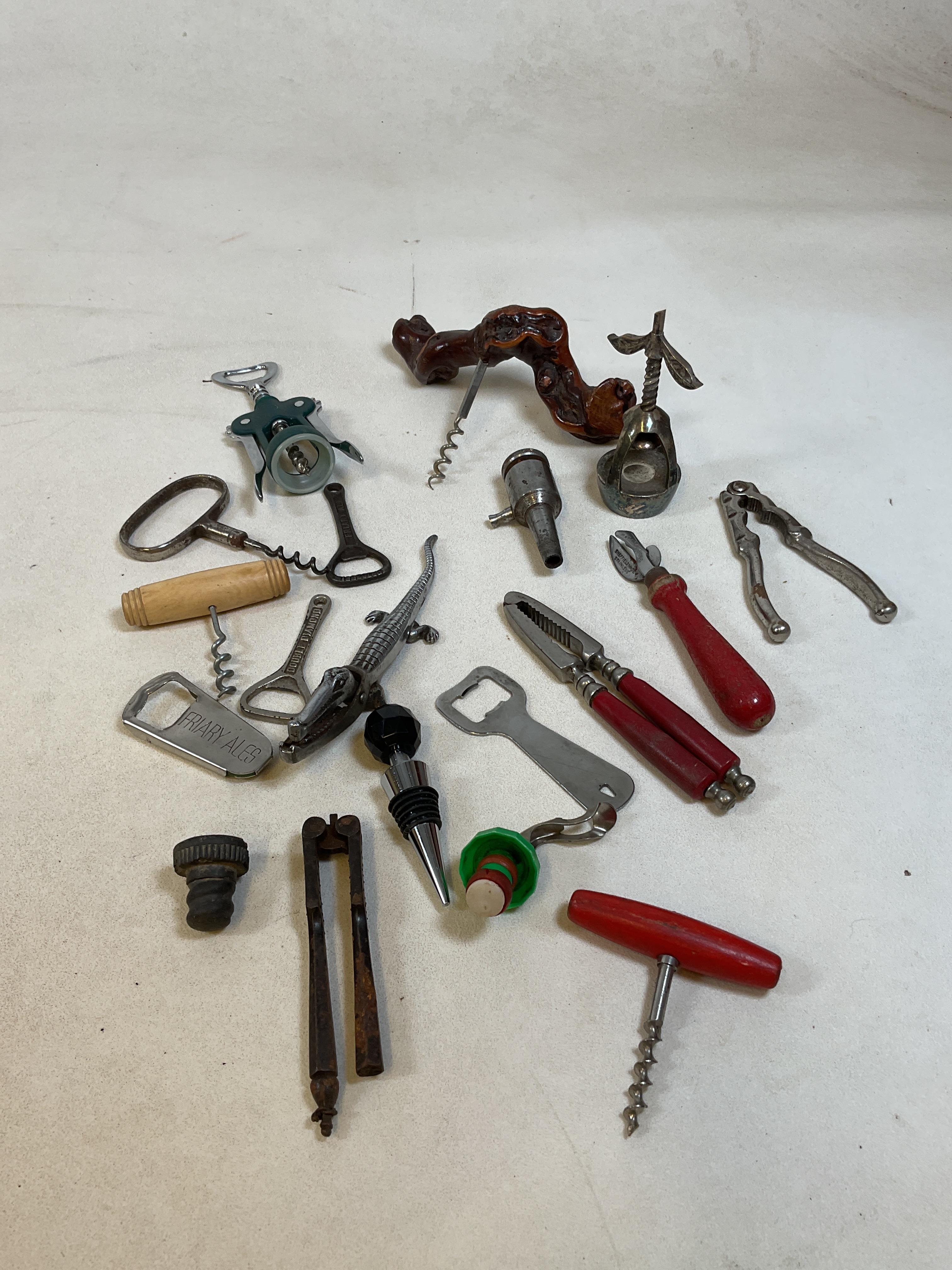 Lot 206 - A collection of corkscrews, pen knives, nut