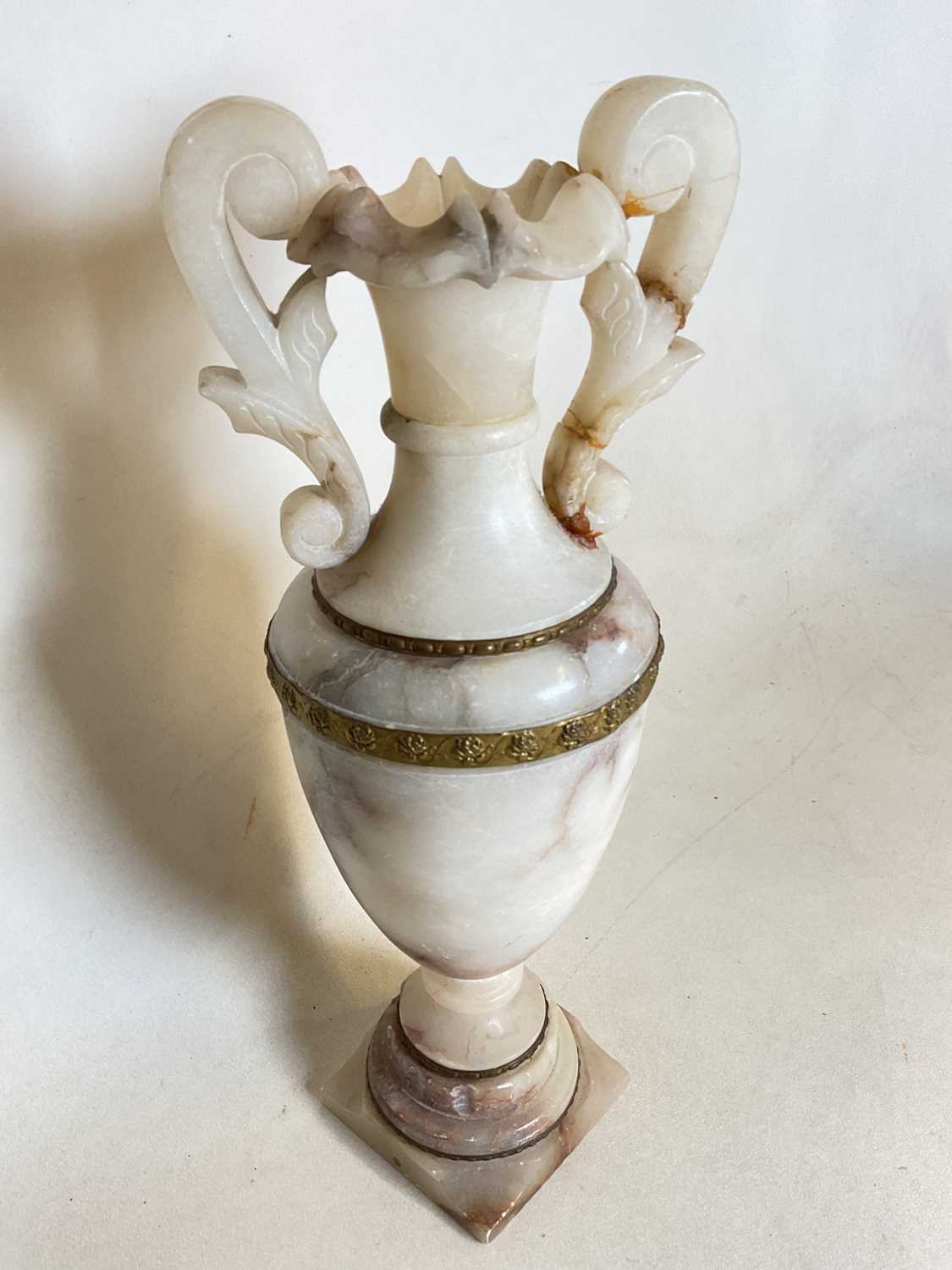 Lot 231 - An alabaster vase with twin handles, height