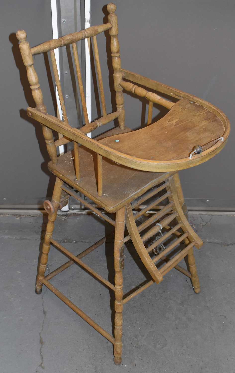 Lot 63 - A pine metamorphic high chair.