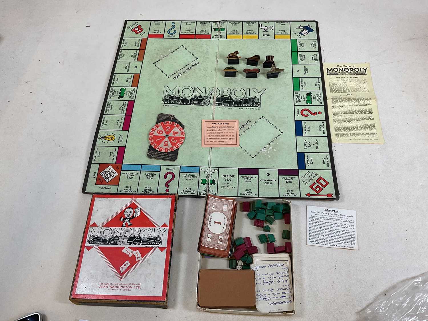 Lot 100 - A post war Monopoly set and board (A/ F) and