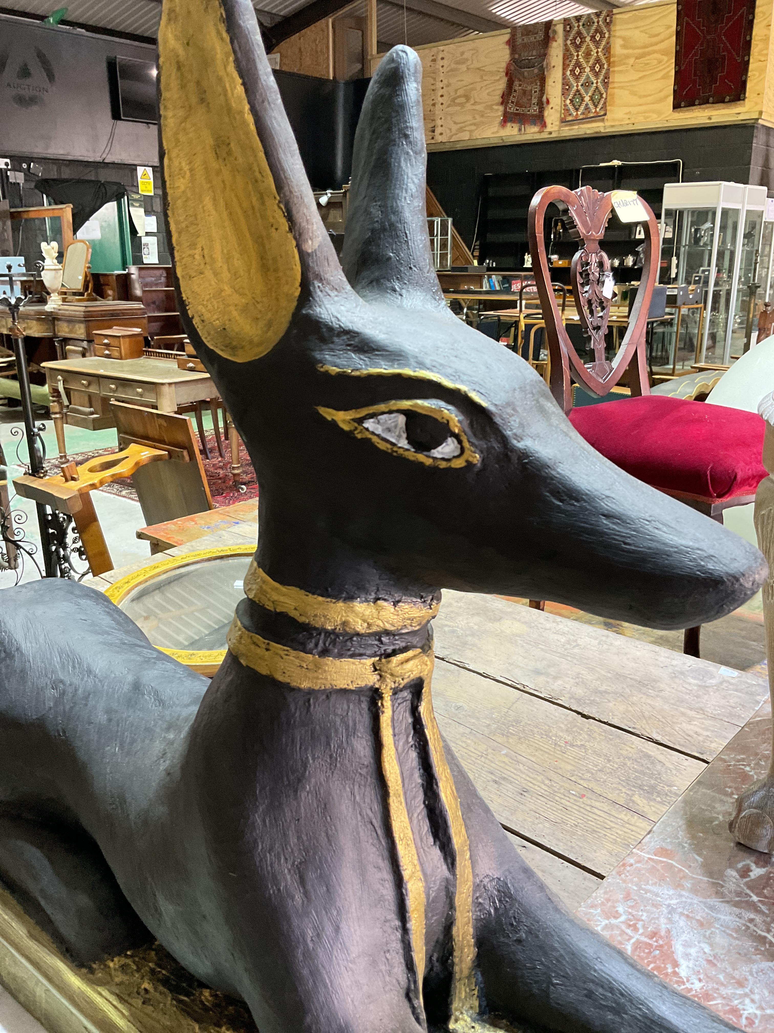 Lot 515 - A large resin Anubis sculpture, height 64cm,