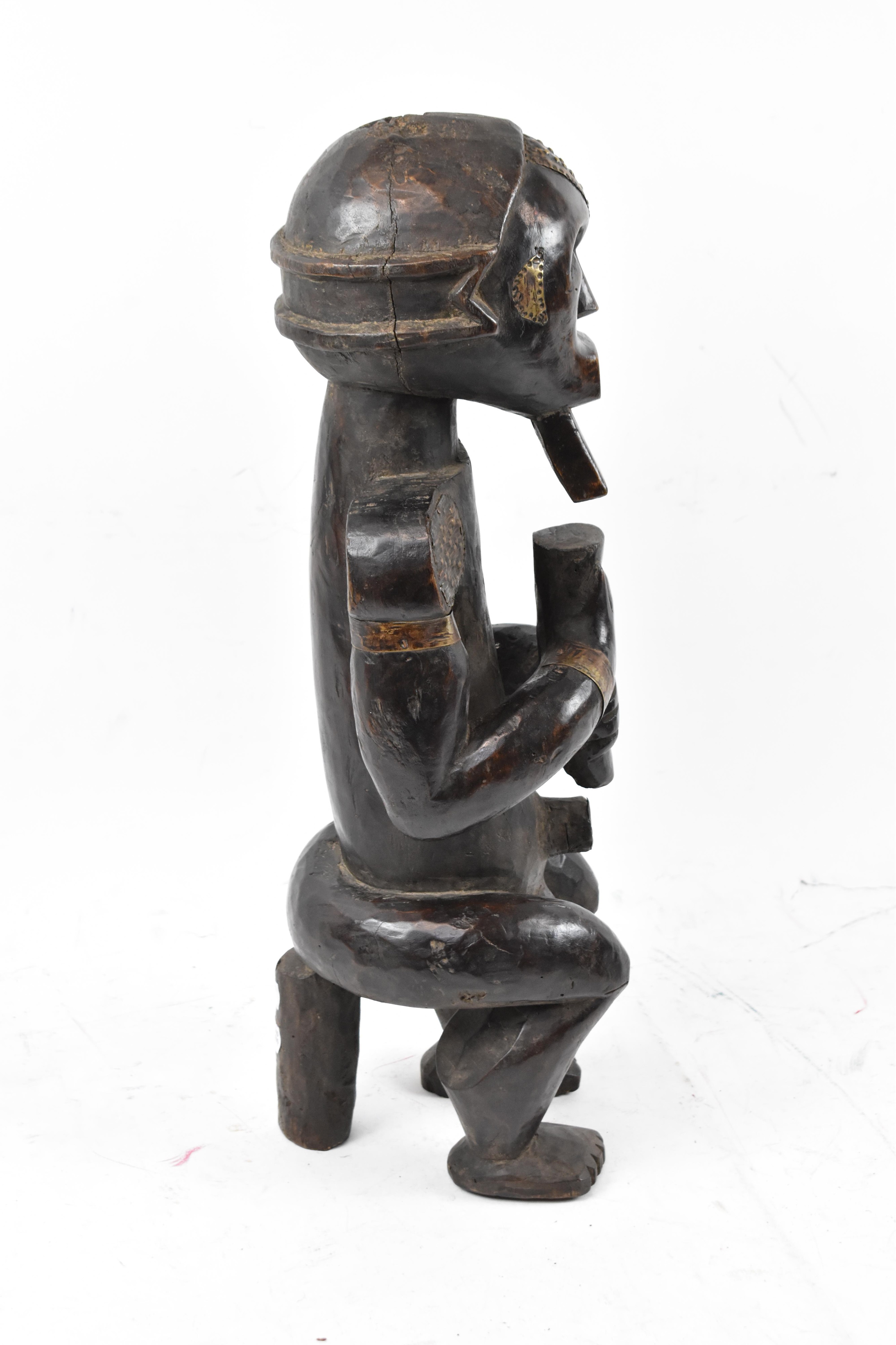 Lot 24 - A Fang reliquary figure, Gabon, applied with