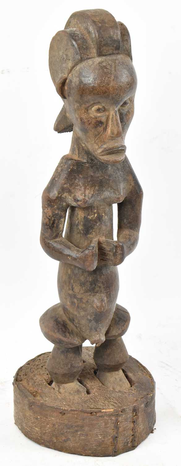 Lot 38 - A Fang, Gabon, figure set in a rustic wooden
