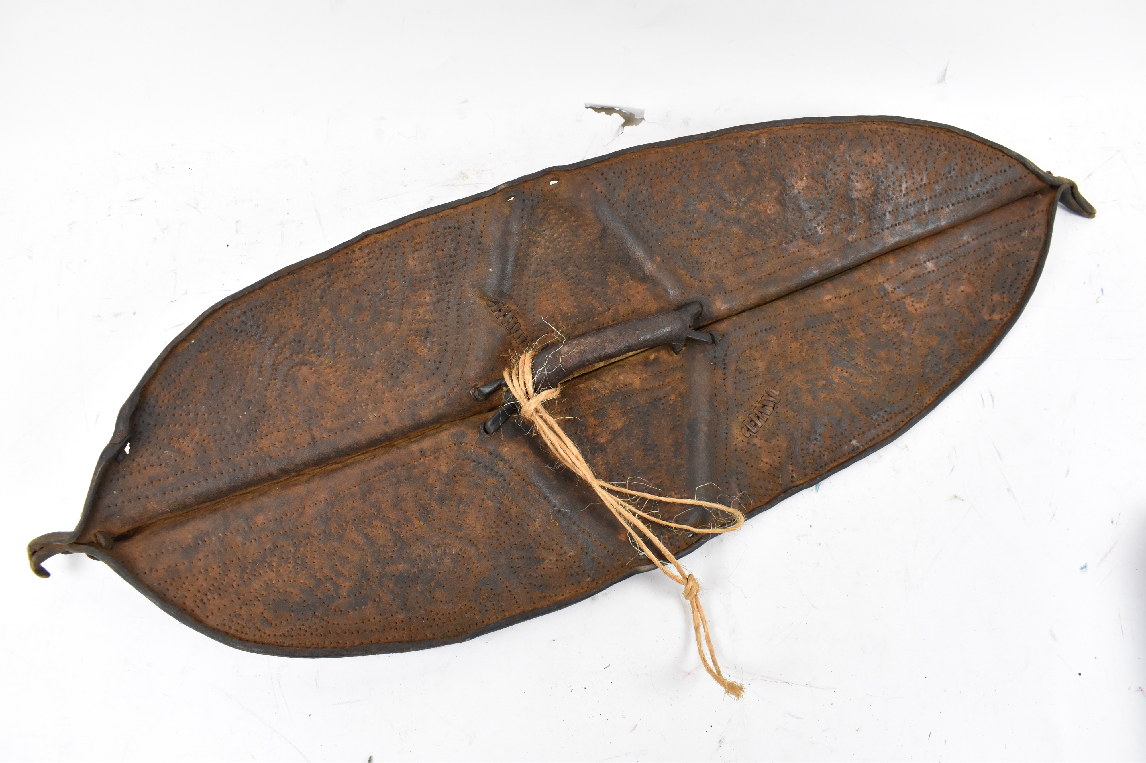 Lot 44 - An African hide shield with traces of painted