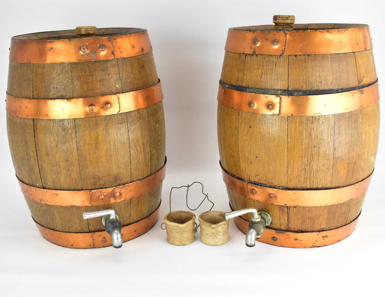 Lot 141 - Two coopered oak wine barrels/casks with