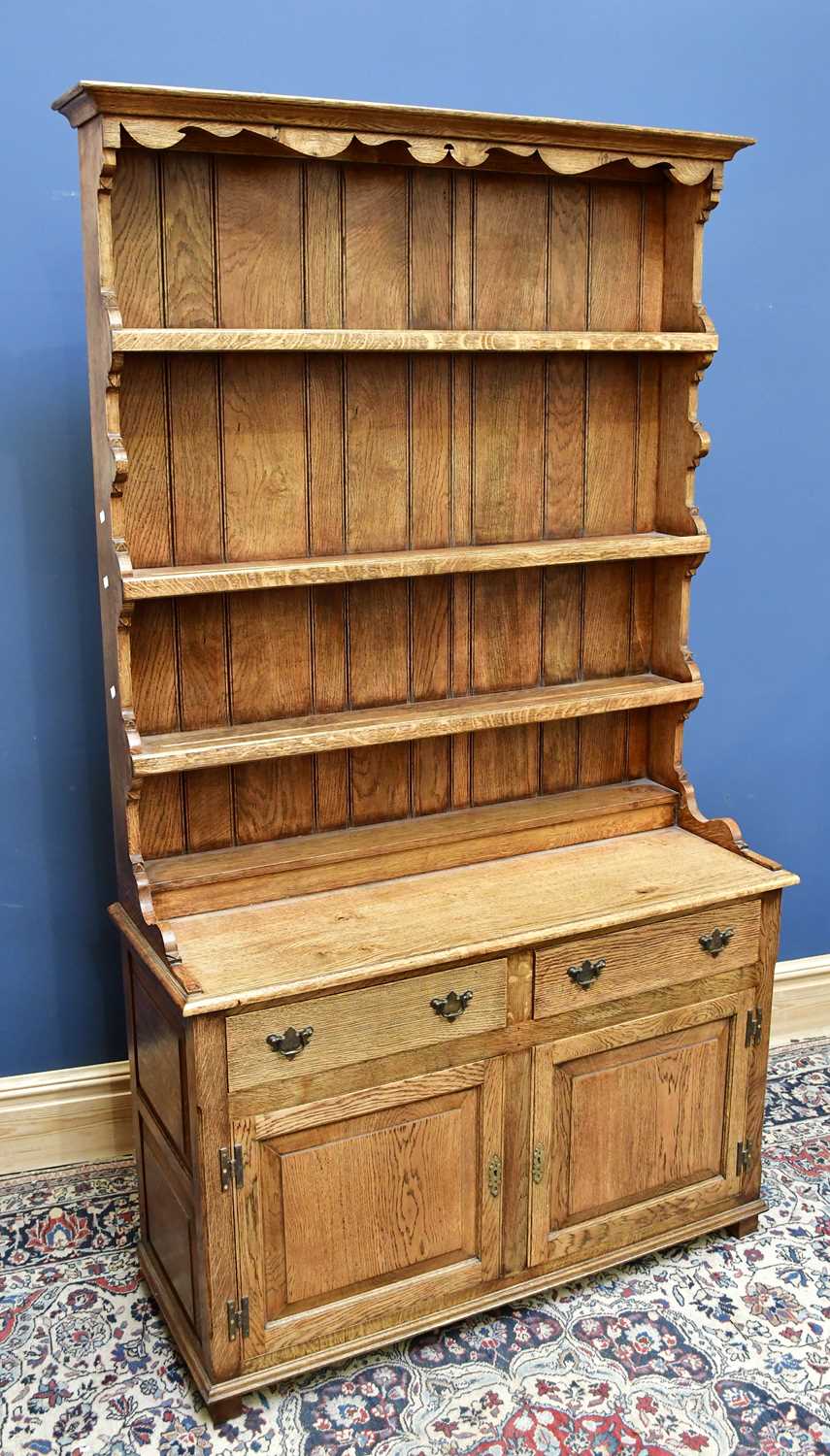 Lot 1698 - ANDREW KIDD; a reproduction oak dresser,