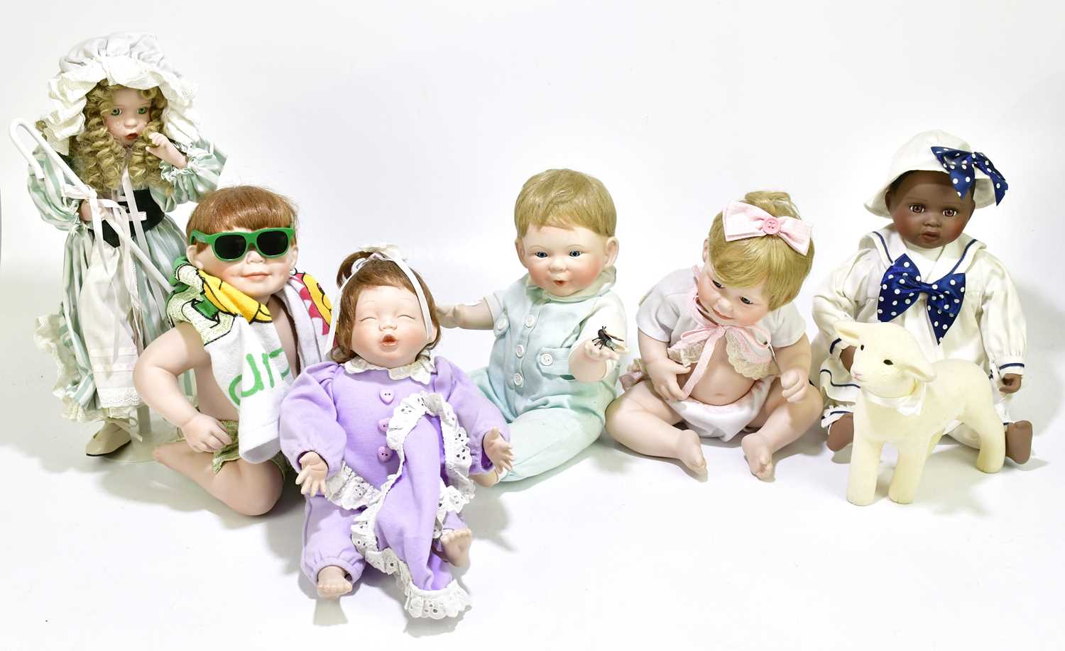 Lot 308 - A group lot of six porcelain dolls, height