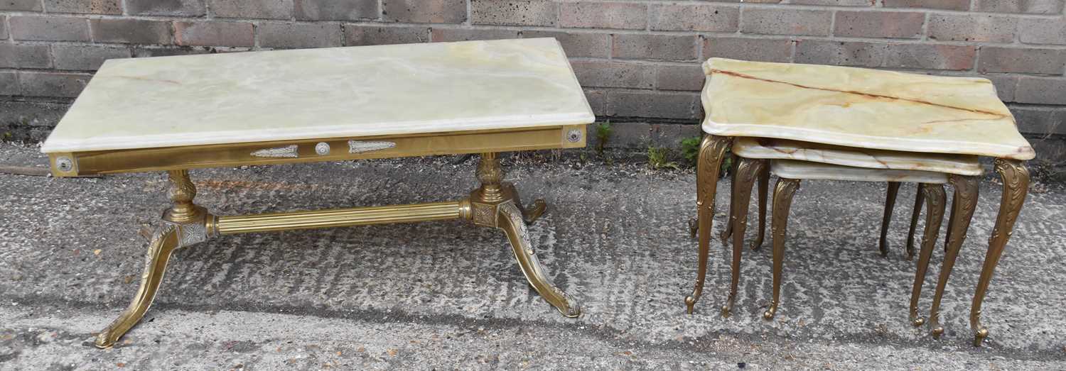 Lot 59 - An onyx topped coffee table with brass base