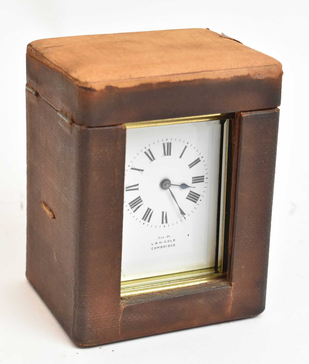 Lot 118 - A brass cased carriage clock in leather
