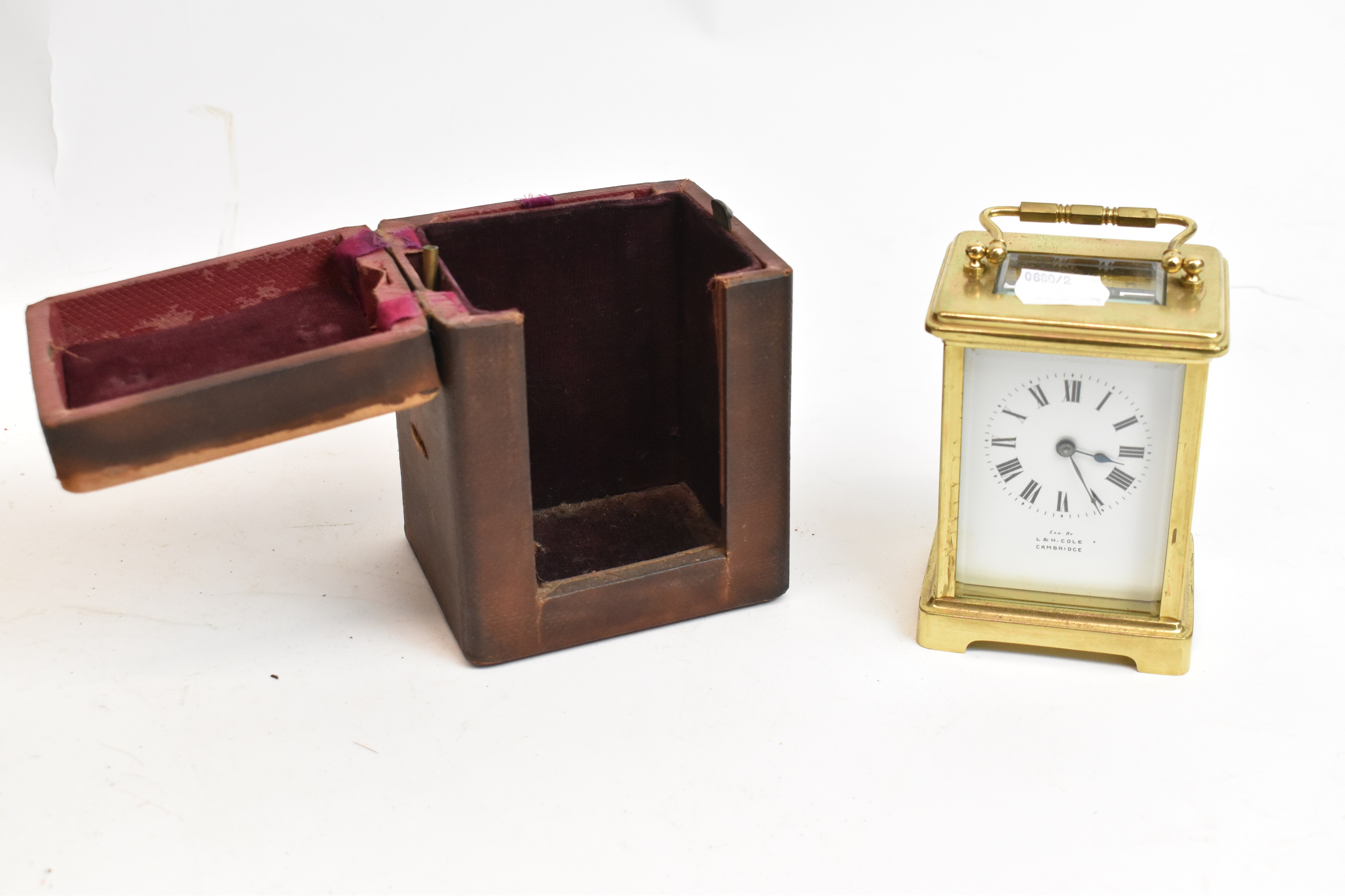 Lot 118 - A brass cased carriage clock in leather