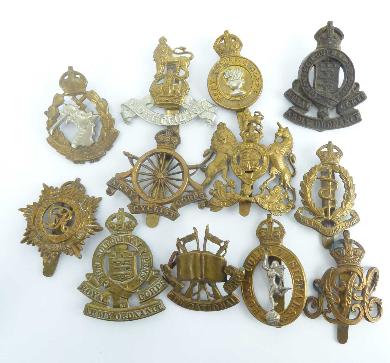 Lot 379 - Twelve military services cap badges