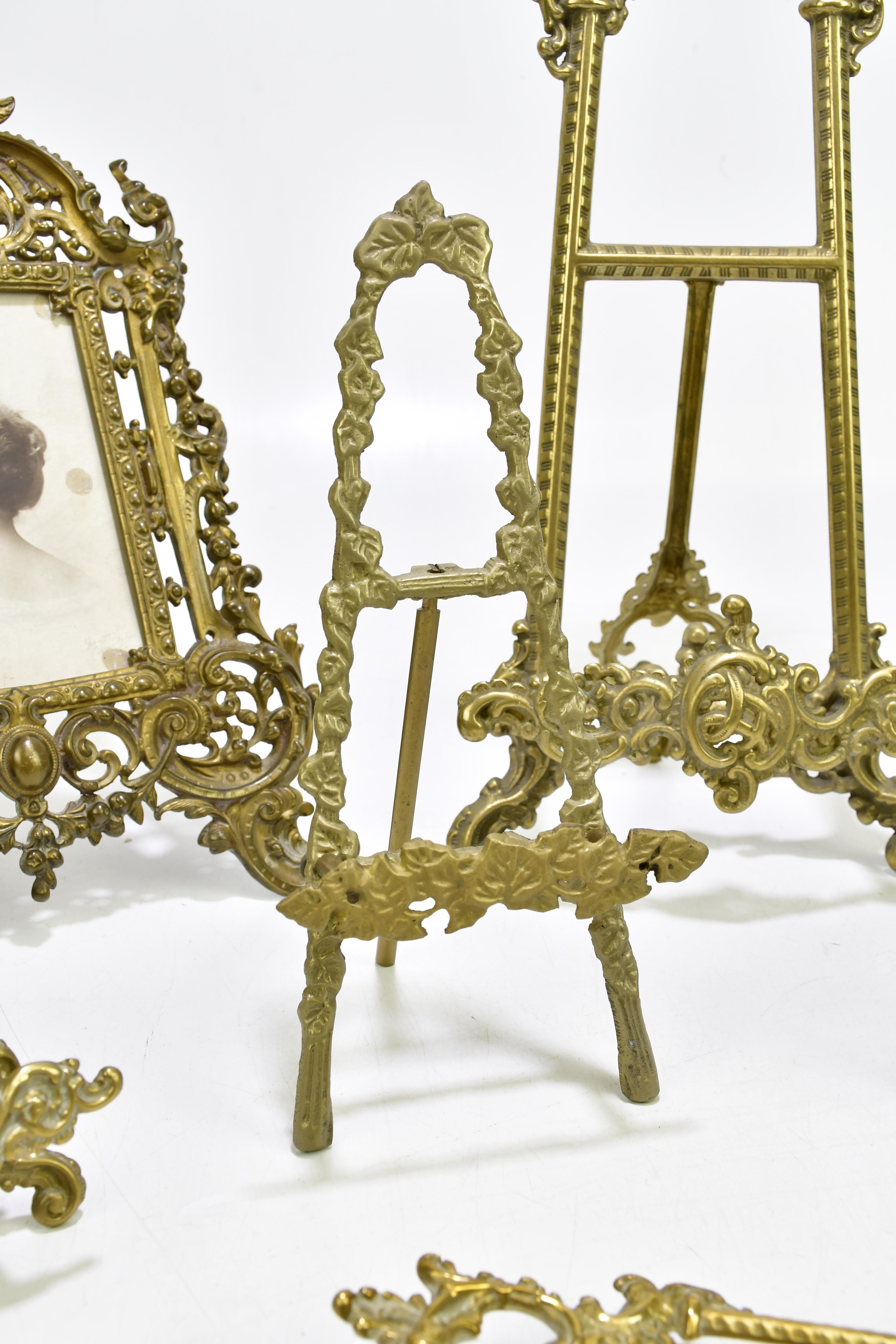 Lot 1159 - A group of six small brass easels, together
