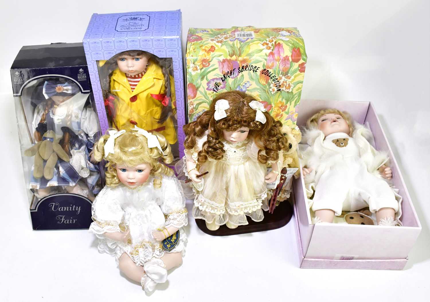 Lot 306 - A group of five boxed porcelain dolls, to