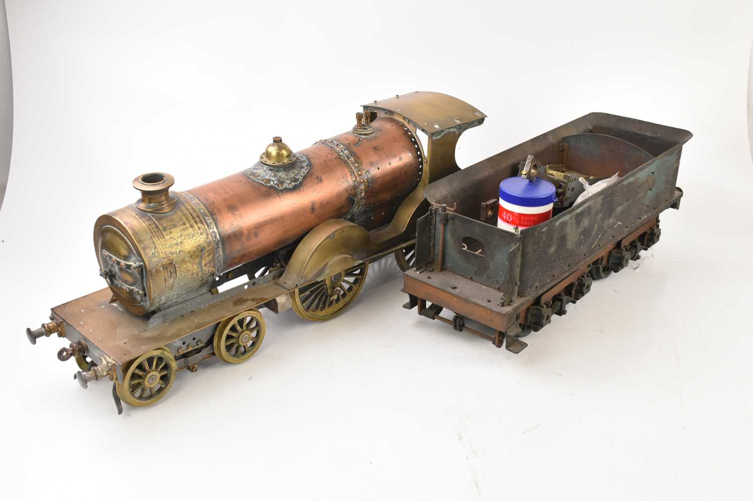 Lot 24 - A copper and brass part built locomotive,