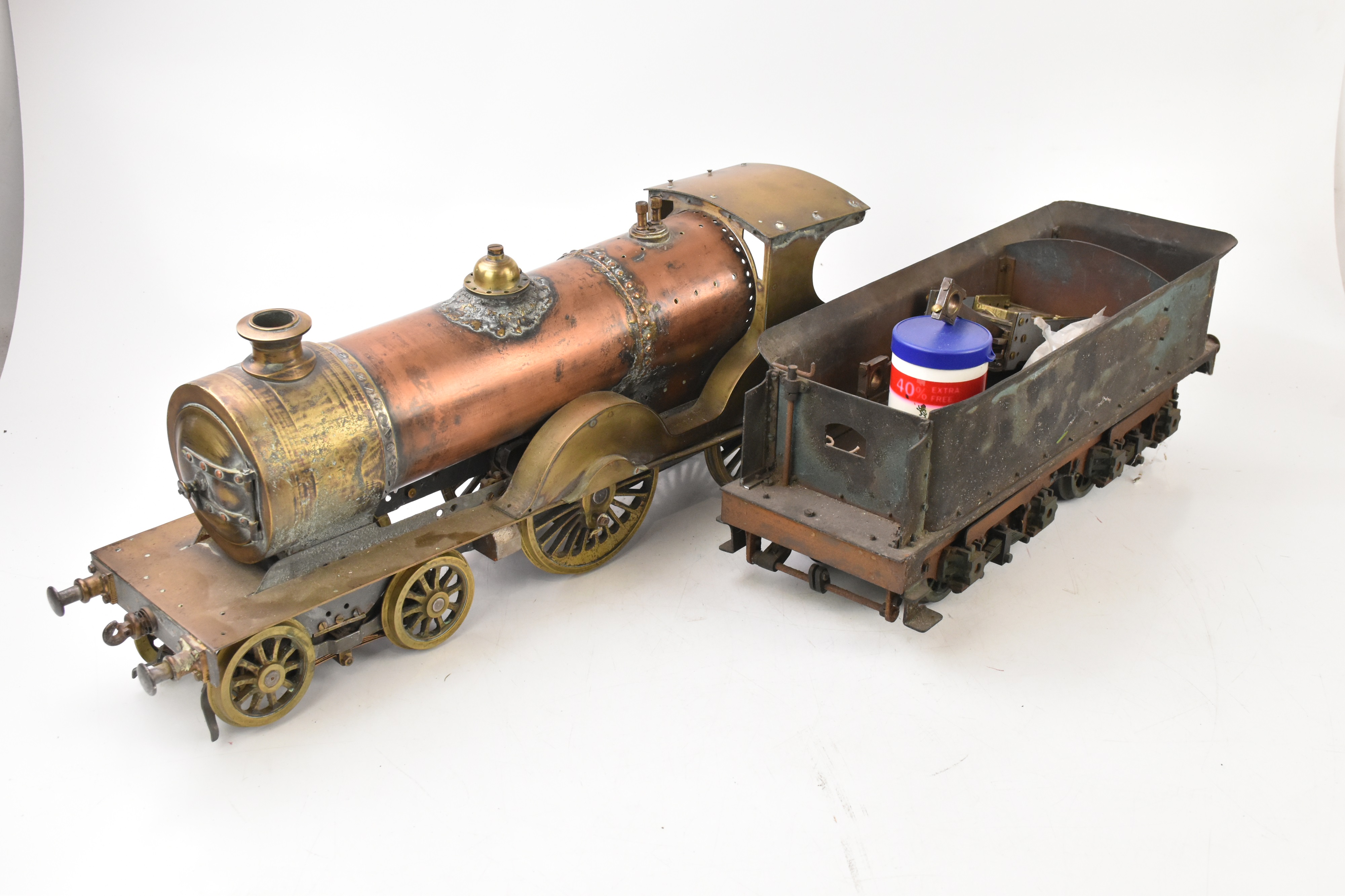 Lot 24 - A copper and brass part built locomotive,