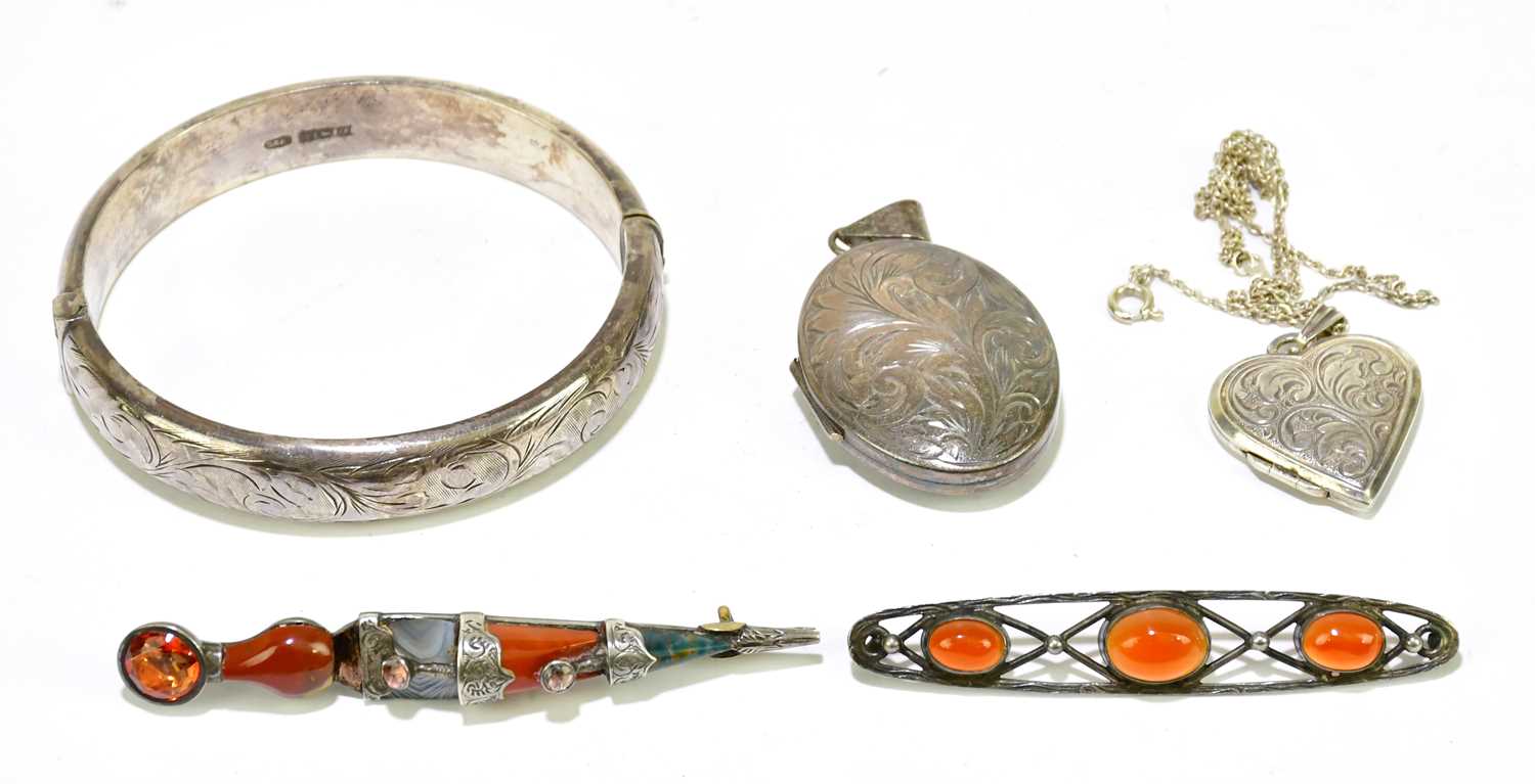 Lot 636 - A Scottish hardstone dagger brooch, a