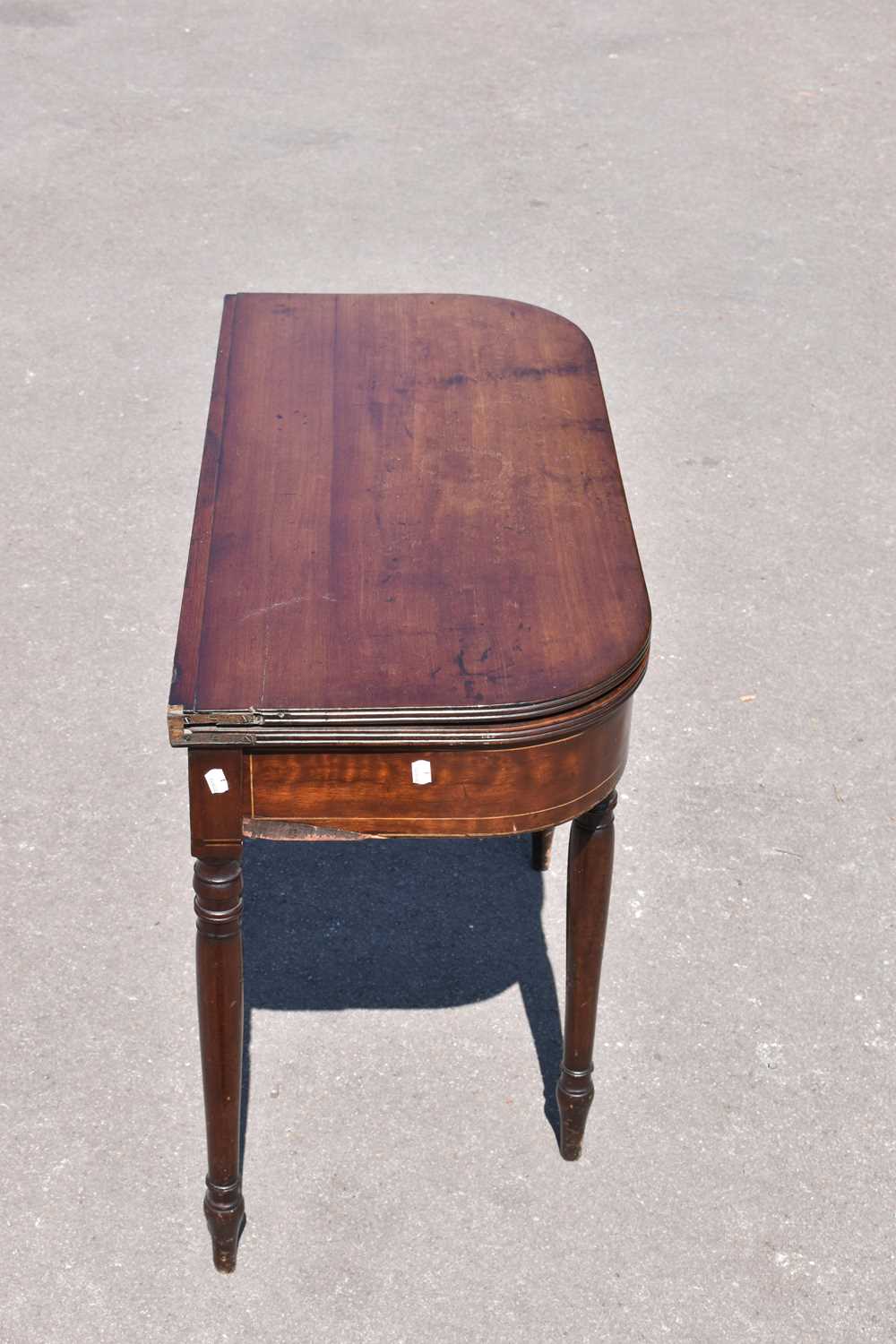 Lot 1651 - A Georgian inlaid mahogany fold over side