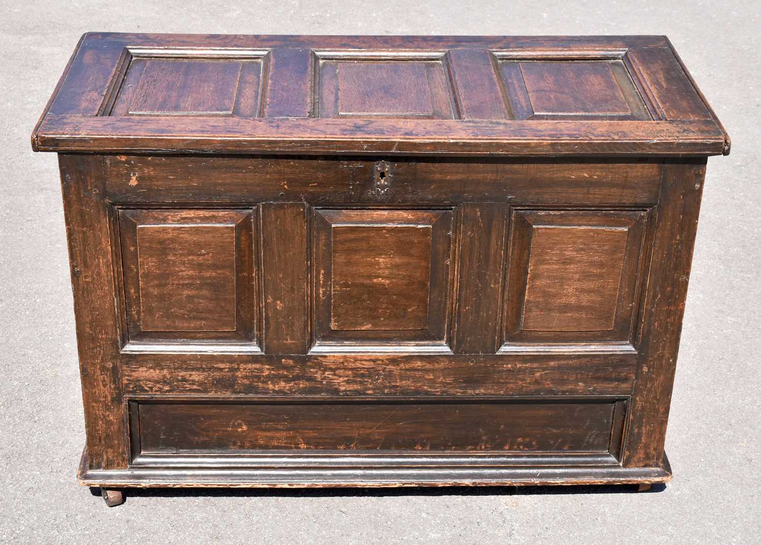 Lot 1659 - An 18th century oak coffer with panelled