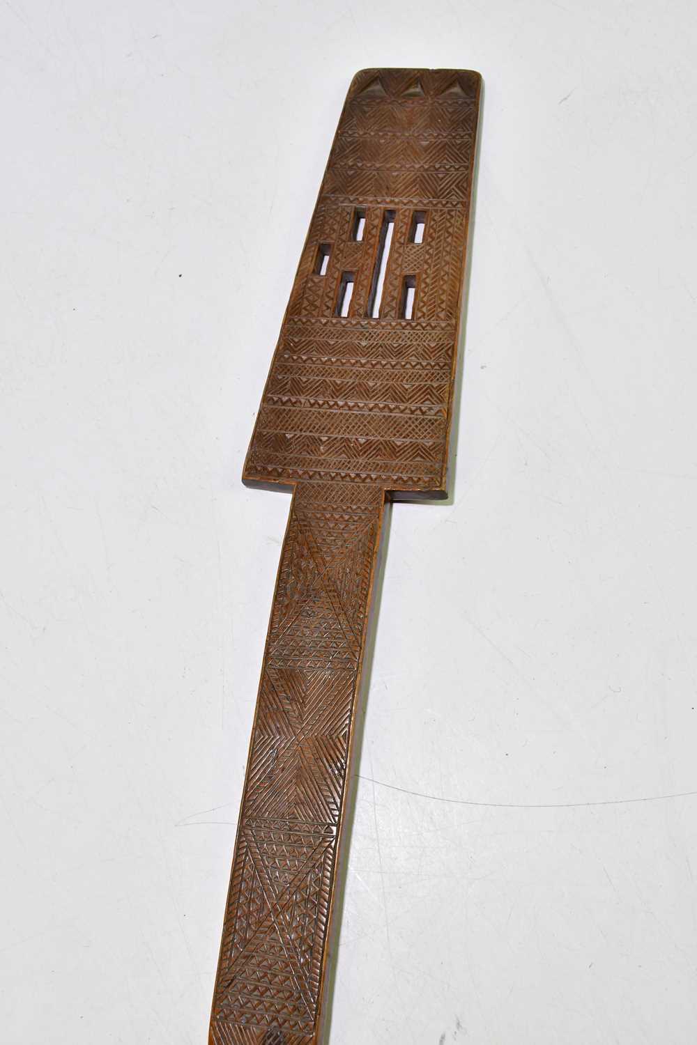 Lot 1116 - An African tribal paddle with chip carved