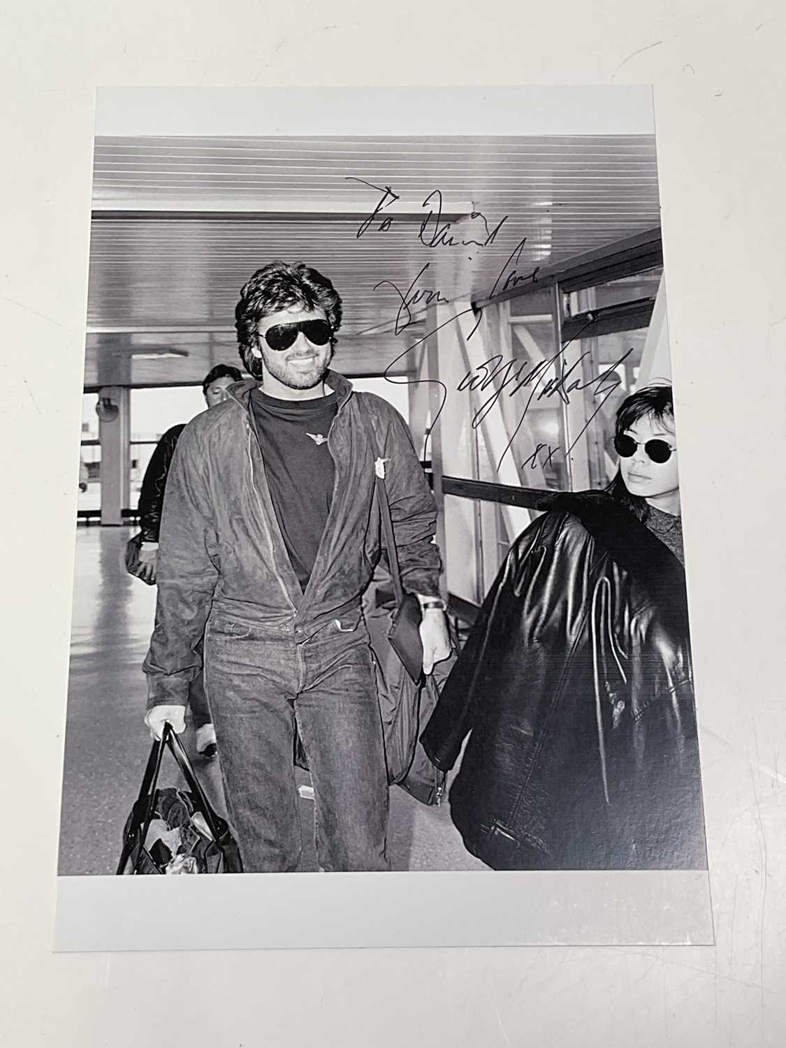Lot 2100 - GEORGE MICHAEL; a black and white