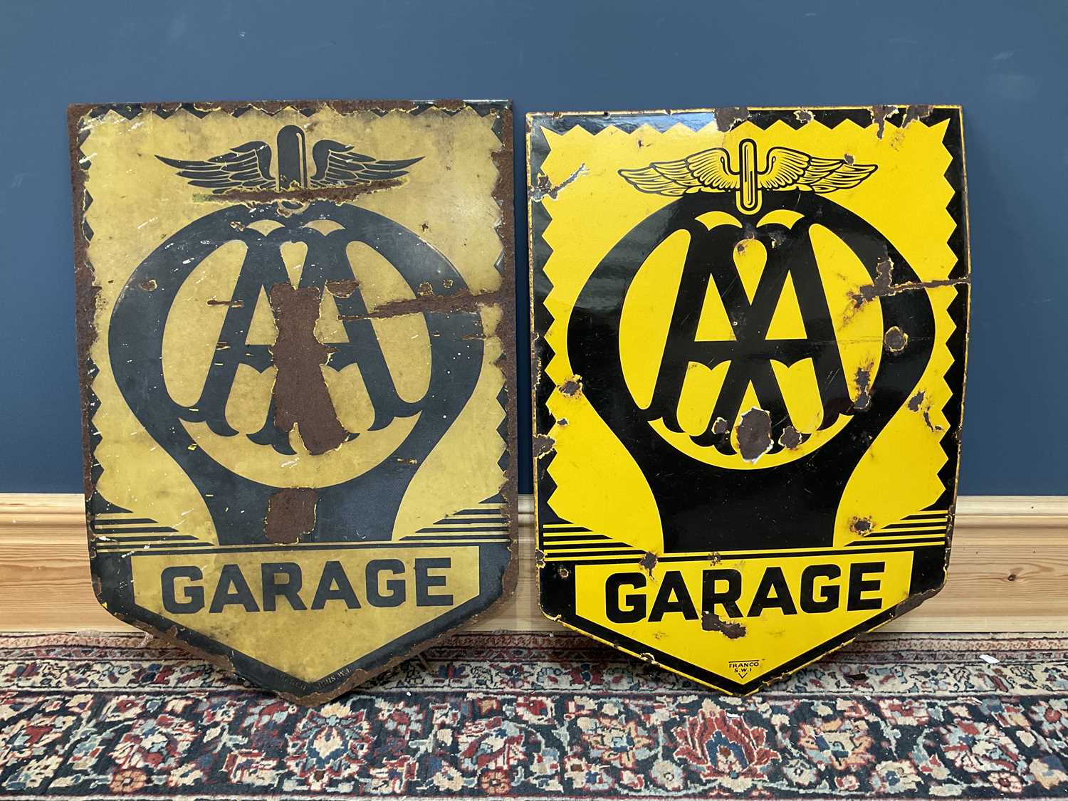 Lot 2009 - Two vintage AA garage shield shaped enamel