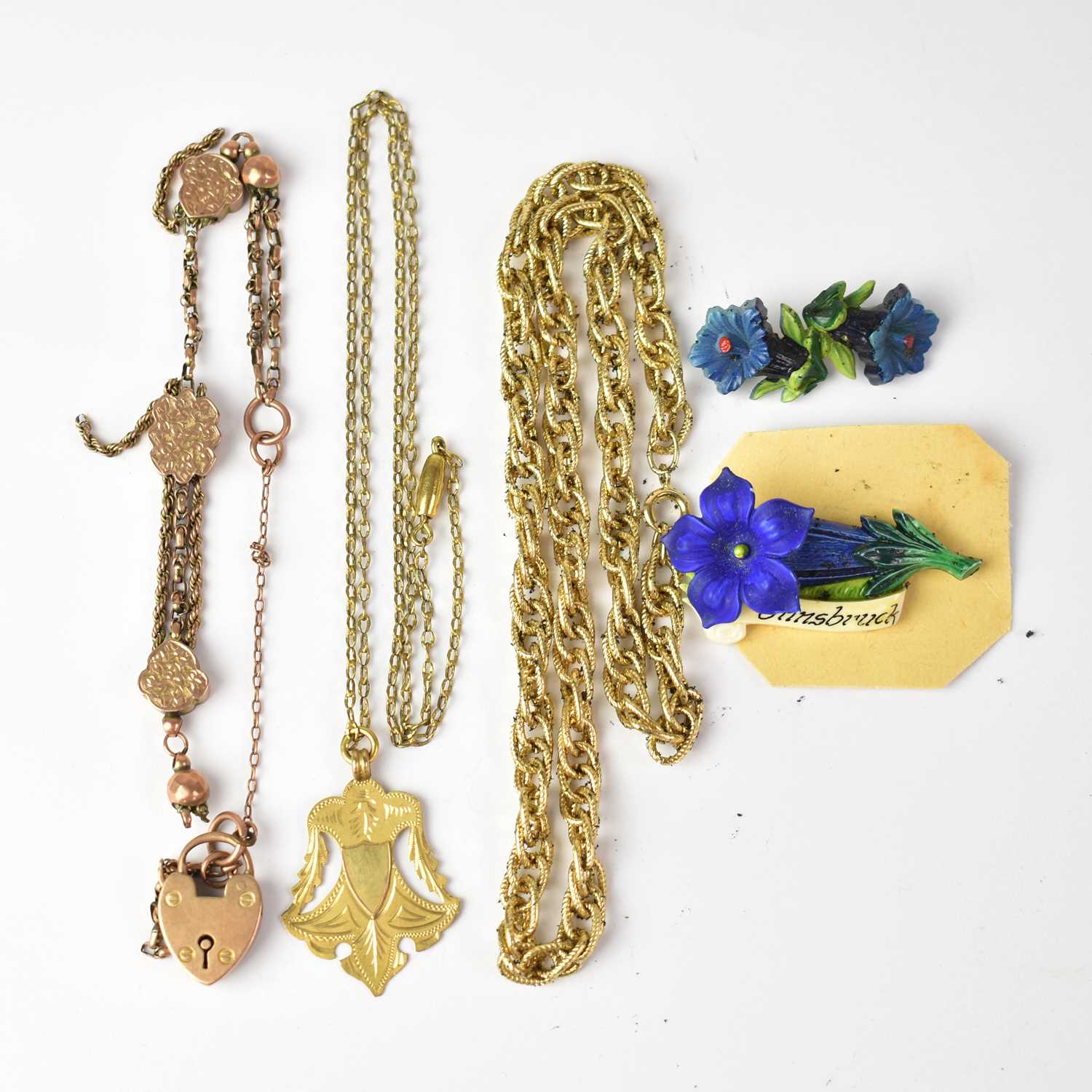 Lot 917 - A 9ct yellow gold shield fob/pendant on a