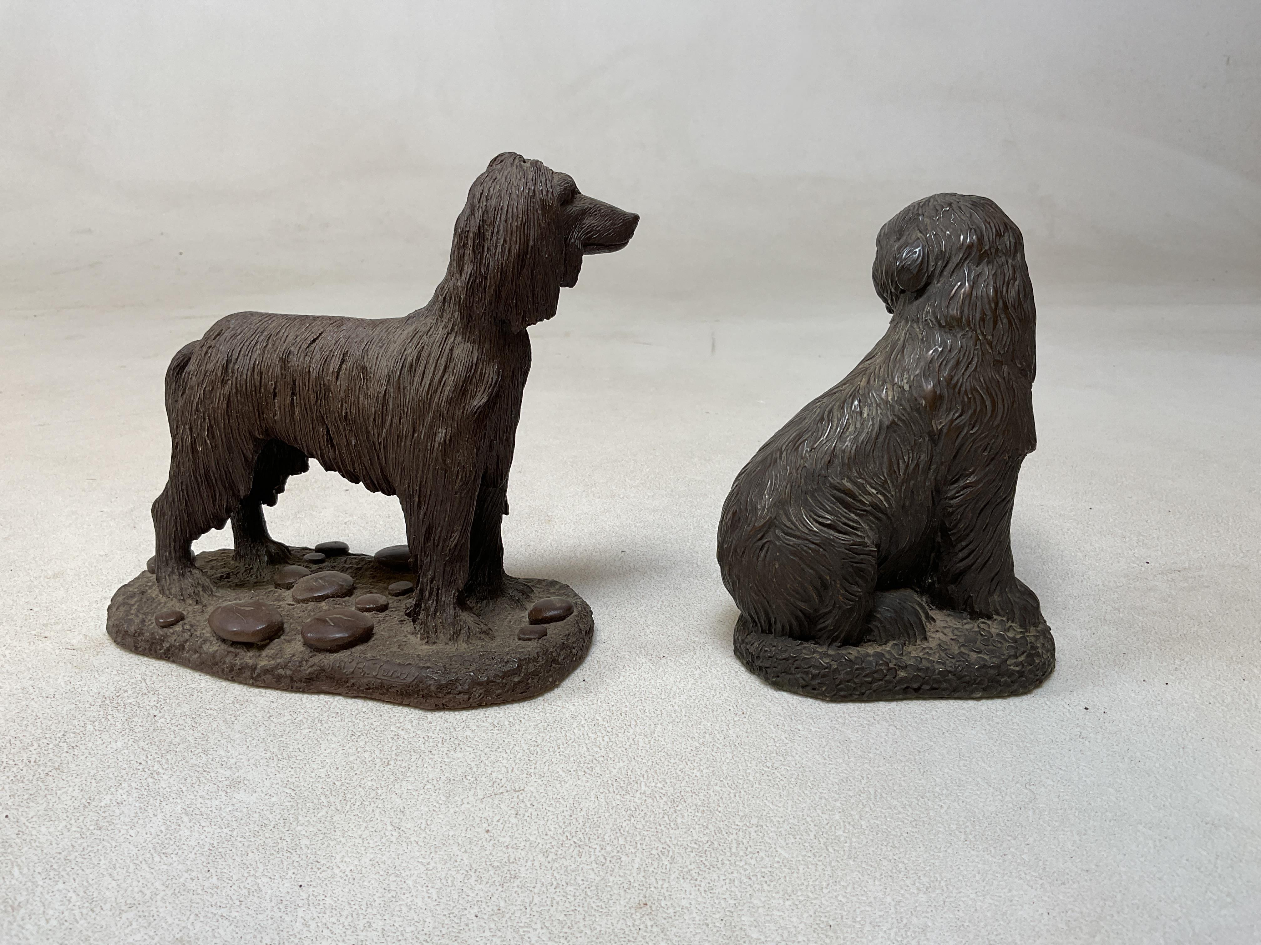 Lot 60 - HEREDITIES; two bronzed resin dogs, largest
