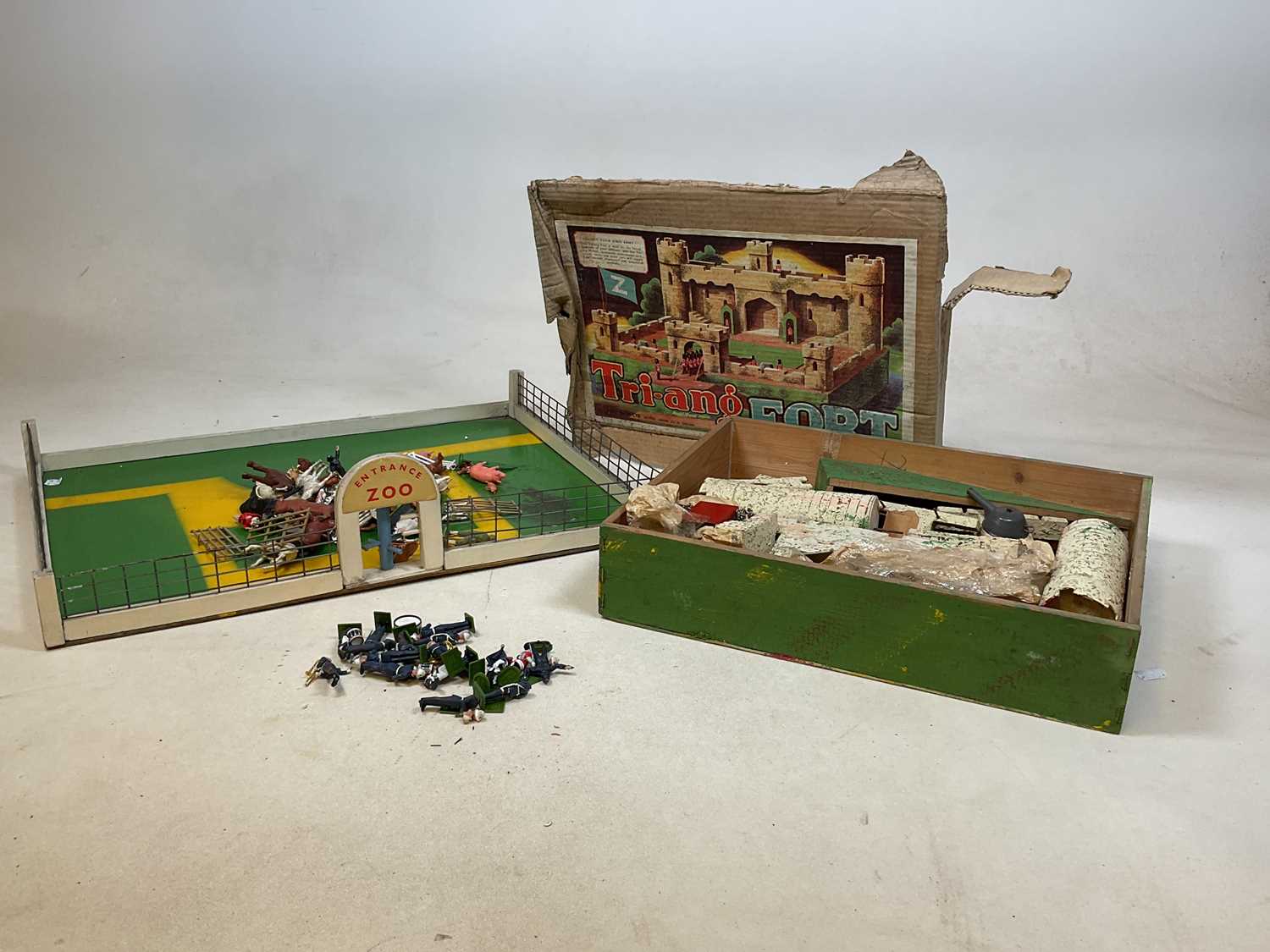 Lot 97 - TRI-ANG; a boxed fort, a zoo paddock display