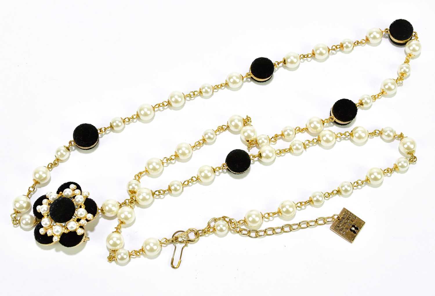 Lot 583 - EDWARD ACHOUR PARIS; a gold tone long metal