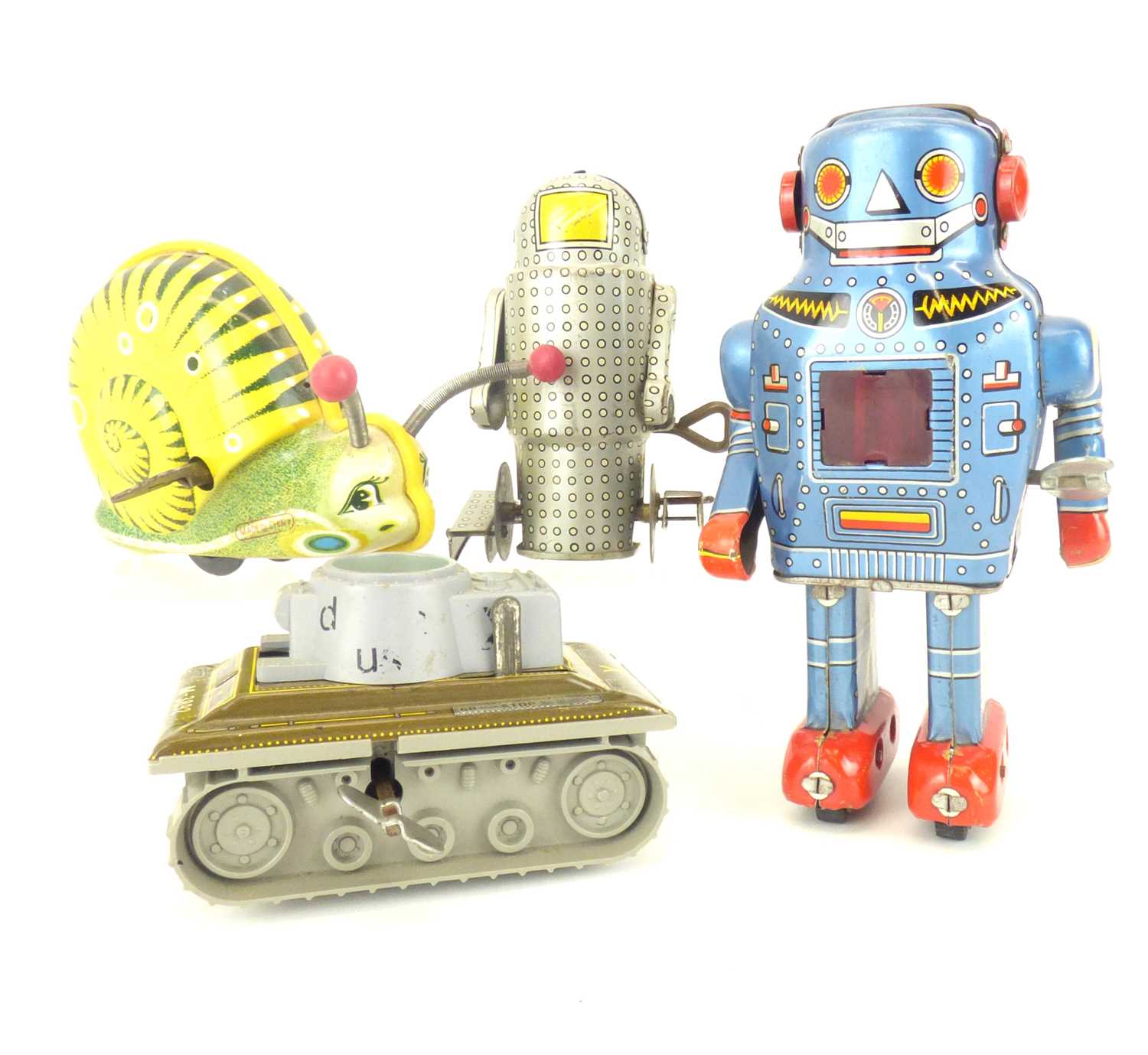 Lot 214 - Four vintage tinplate clockwork toys