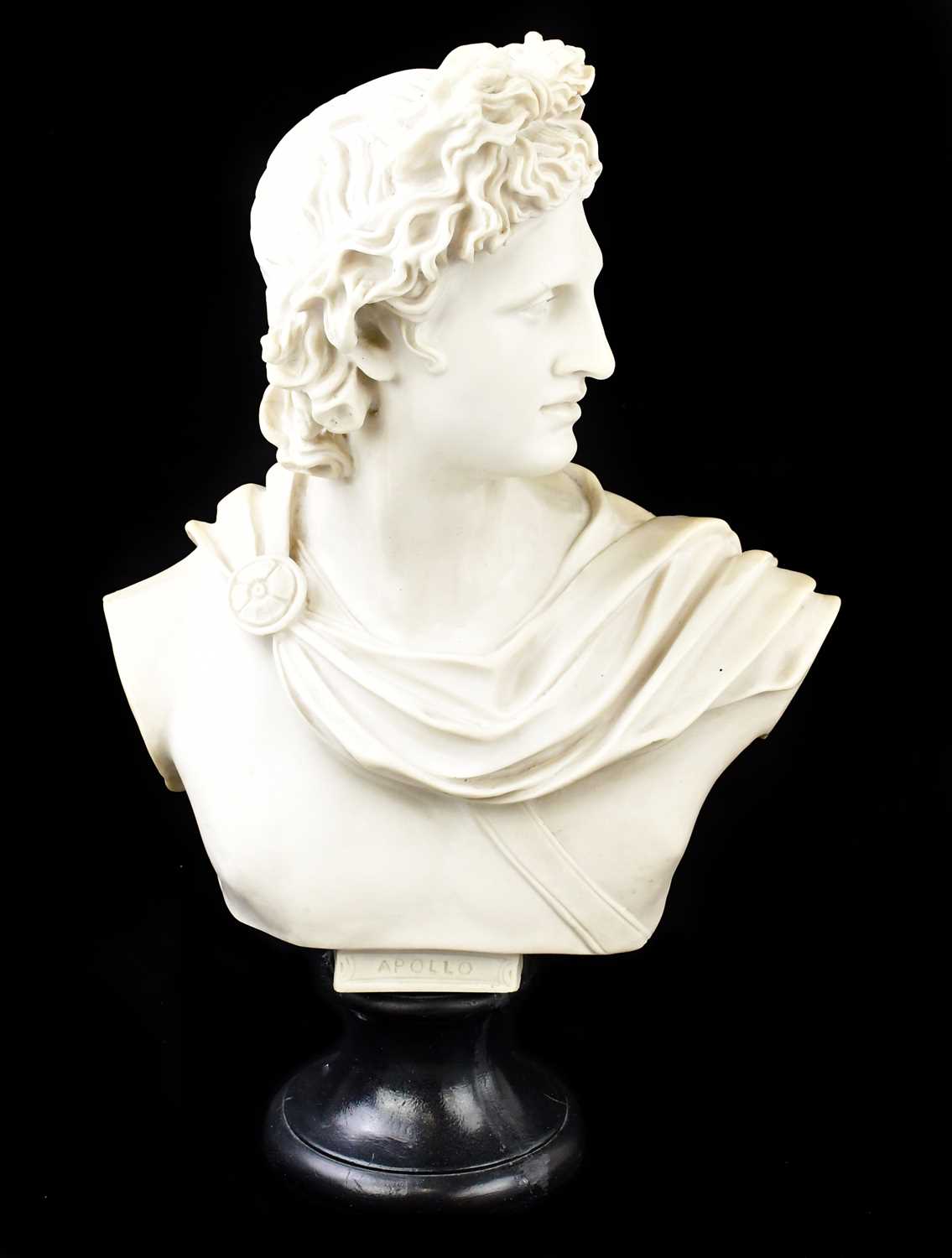 Lot 2131 - A decorative resin bust of Apollo on socle,