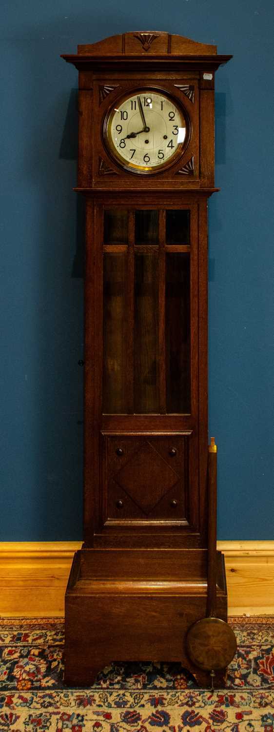 Lot 2285 - A 1920s oak longcase clock, with silvered