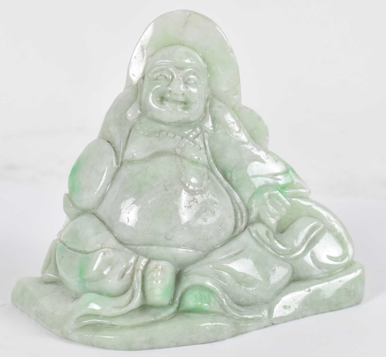 Lot 507 - A Chinese jade carving of a seated Buddha,